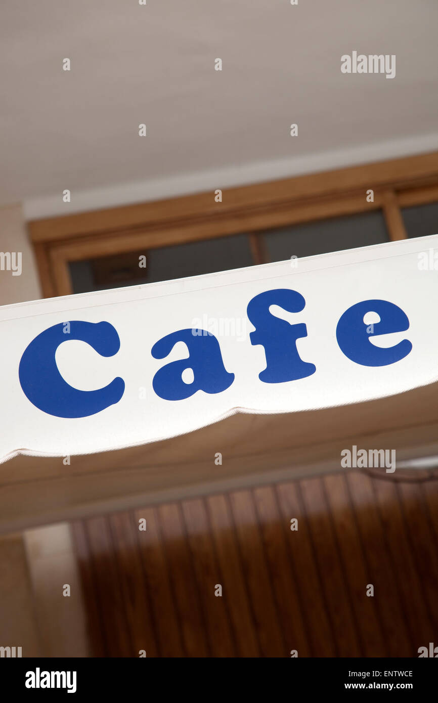 Blue Cafe Sign in Urban Setting Stock Photo - Alamy