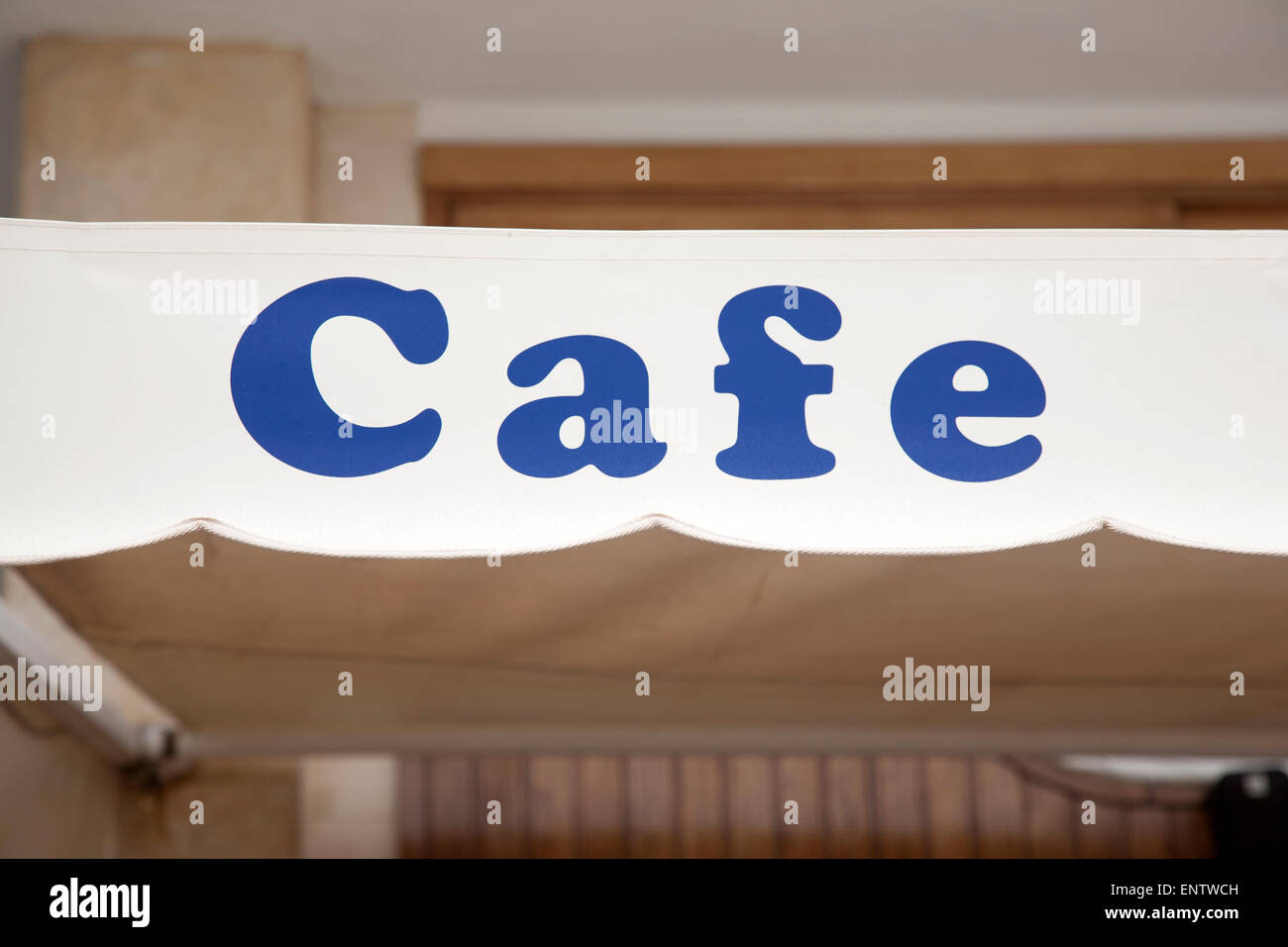 Blue Cafe Sign in Urban Setting Stock Photo - Alamy