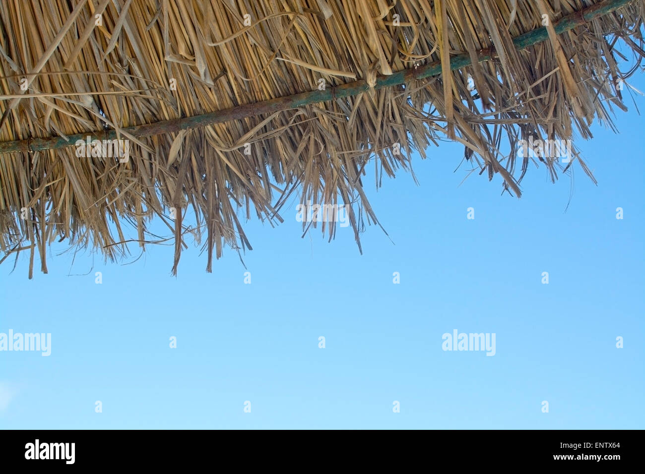 Detail of straw parasol and blue sky copy space. Mallorca, Balearic ...