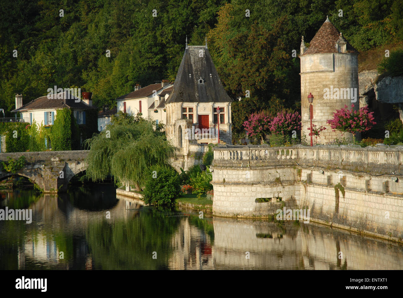 Early morning reflections in the River Dronne at Brantome, Dordogne ...