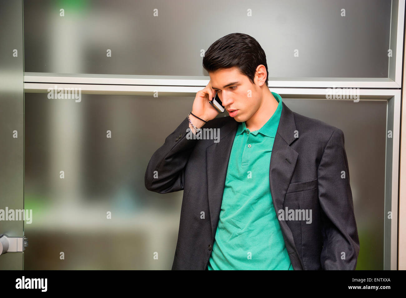 Serious young handsome businessman talking hi-res stock photography and ...