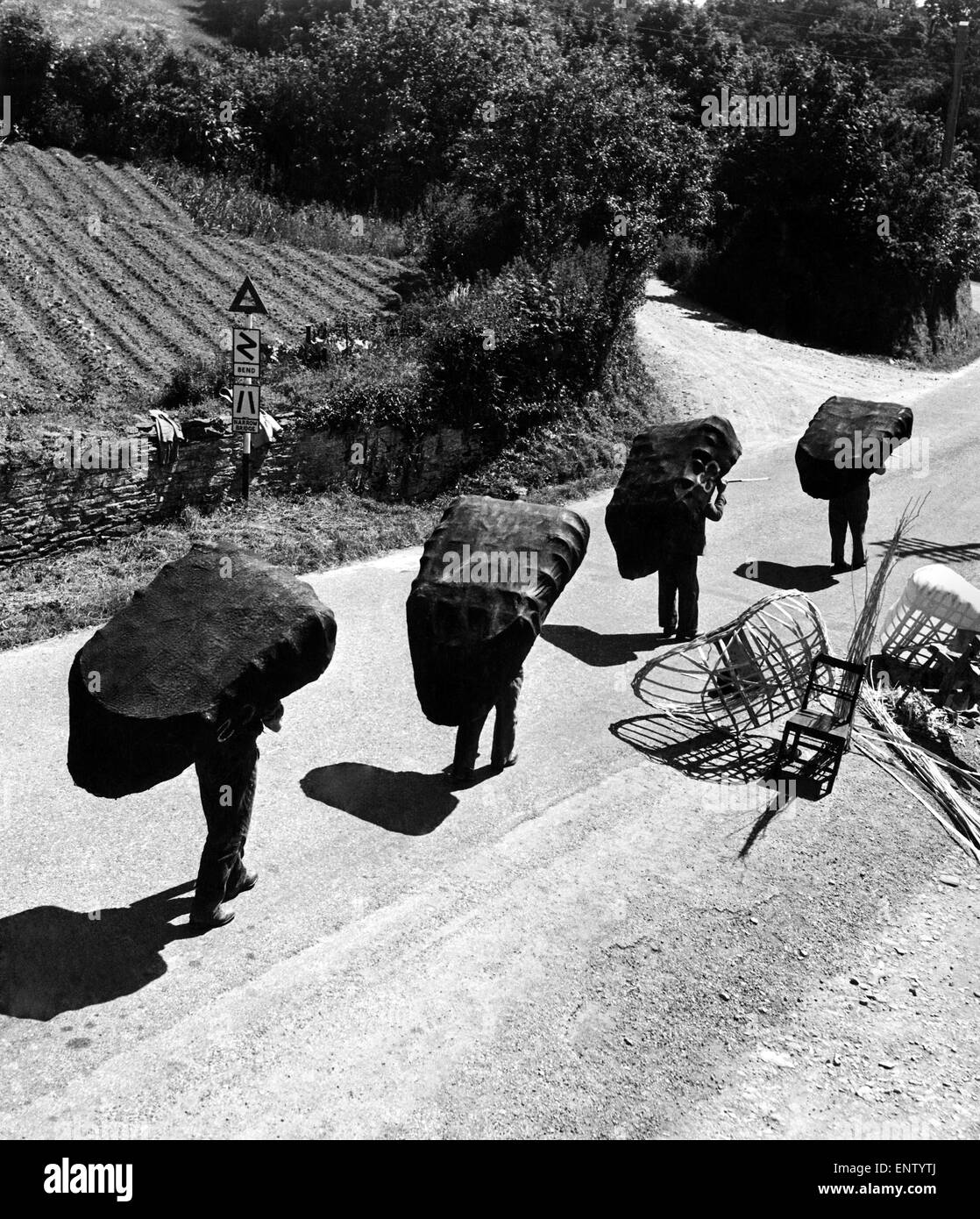 Coracle fishers at Cenarth carry their Craft on their backs: Following ...