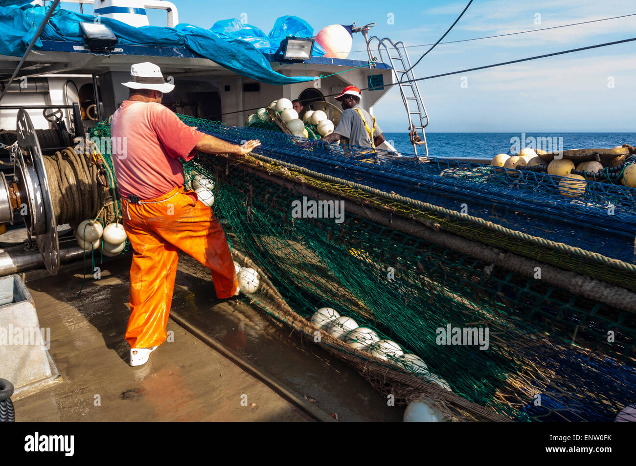 Fishermen working on trawler Stock Photo - Alamy