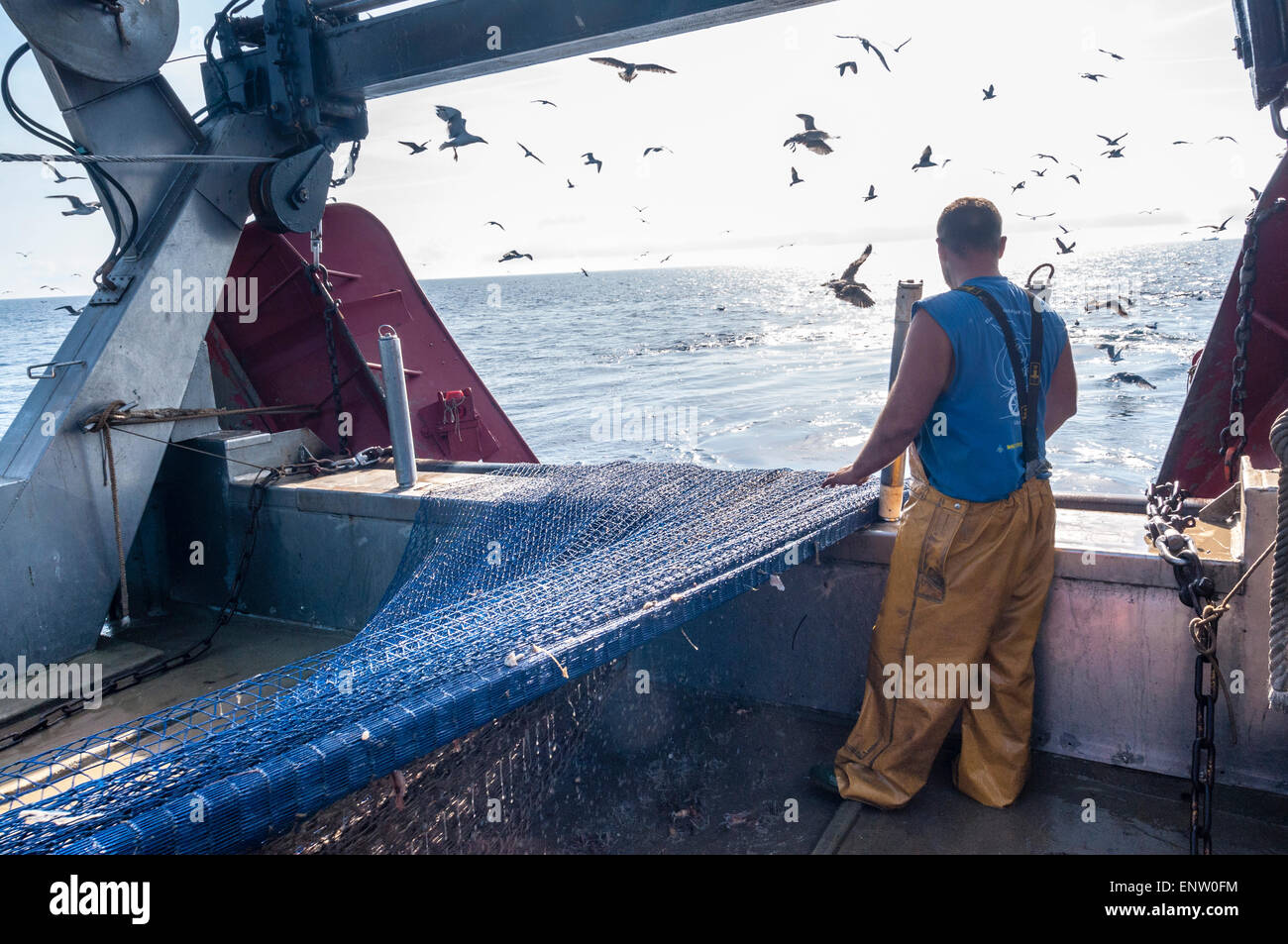 Fishermen working on trawler Stock Photo - Alamy