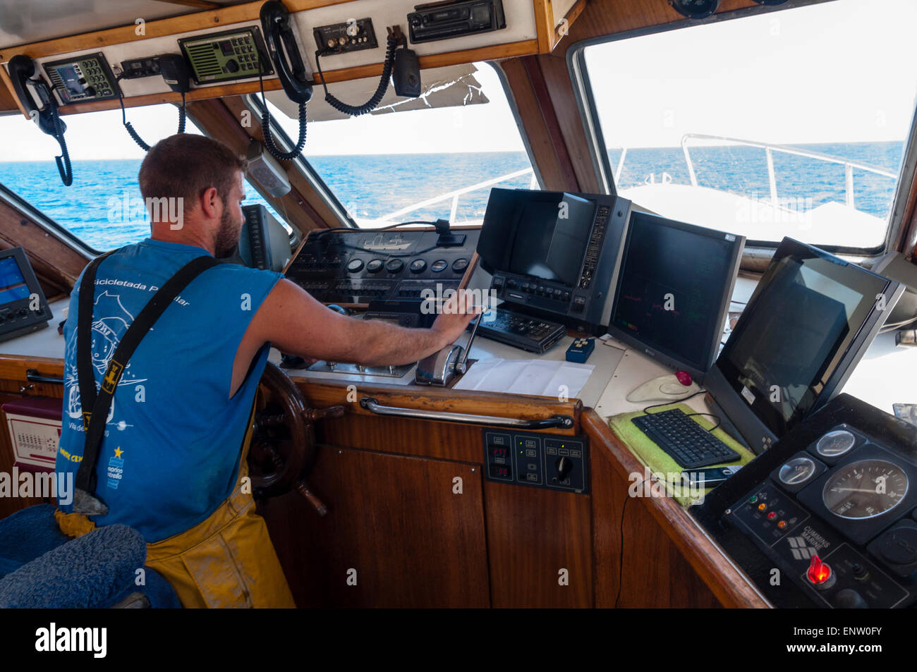 Fishermen working on trawler Stock Photo - Alamy