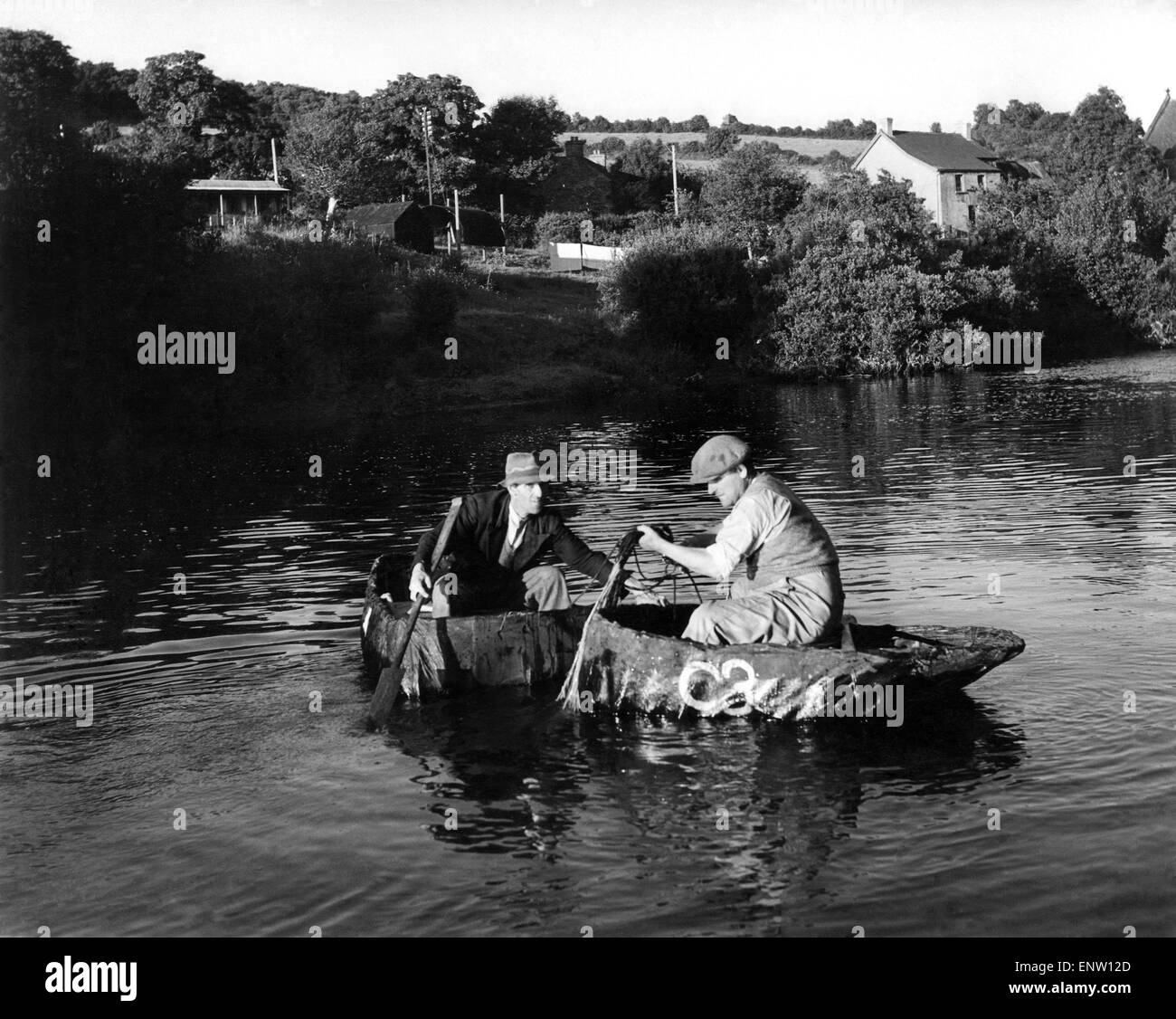 Fisherman fishing boats on Black and White Stock Photos & Images - Alamy