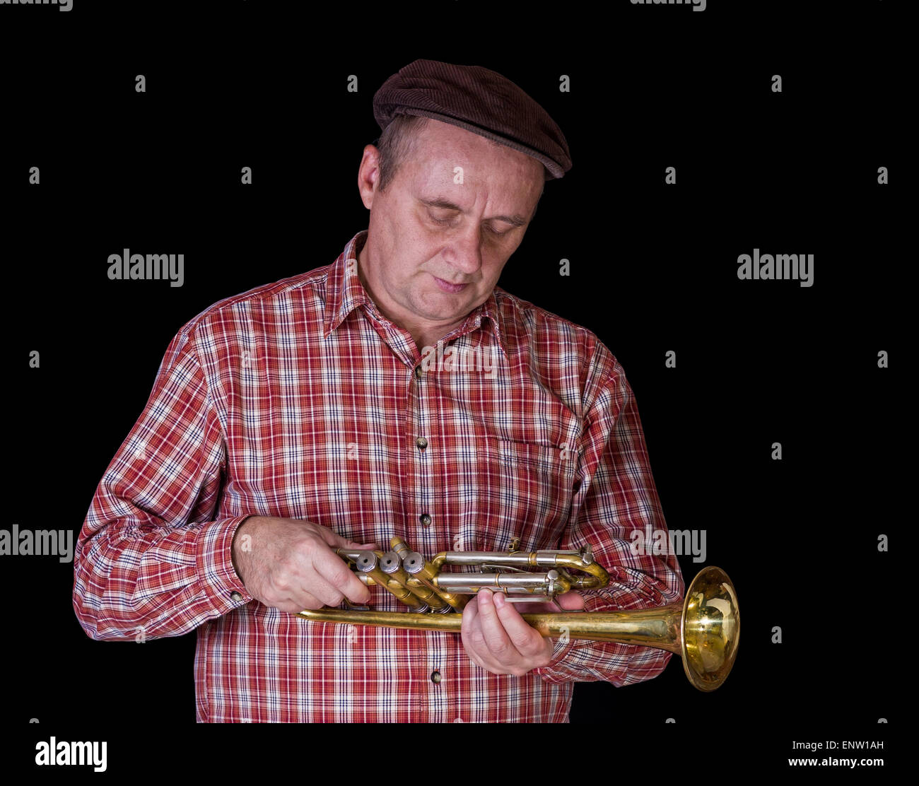 Portrait of mature tuner examining the instrument - trumpet Stock Photo ...