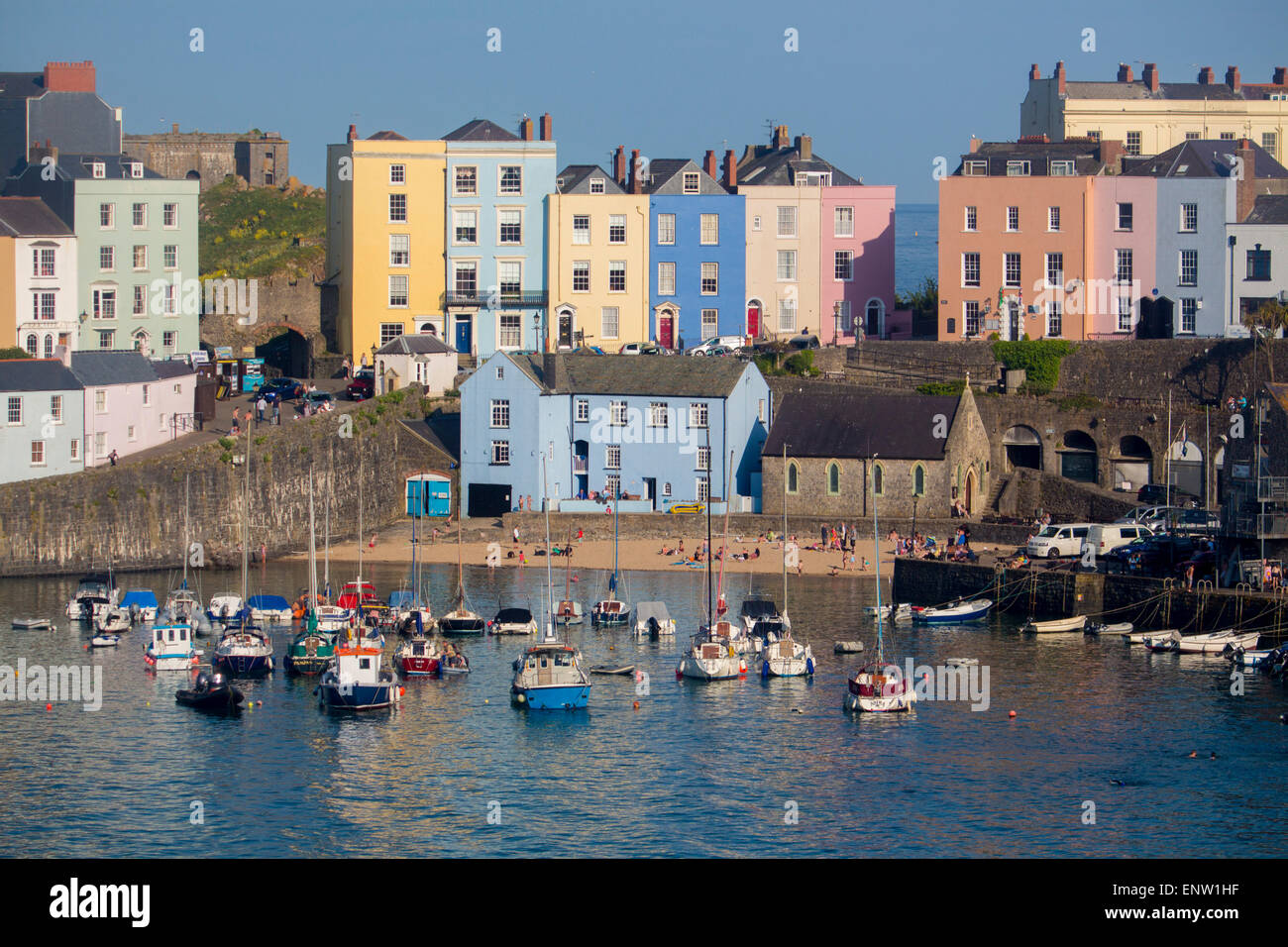 Tenby Harbour with boats at high tide at sunset Tenby Dinbych-y-Pysgod ...