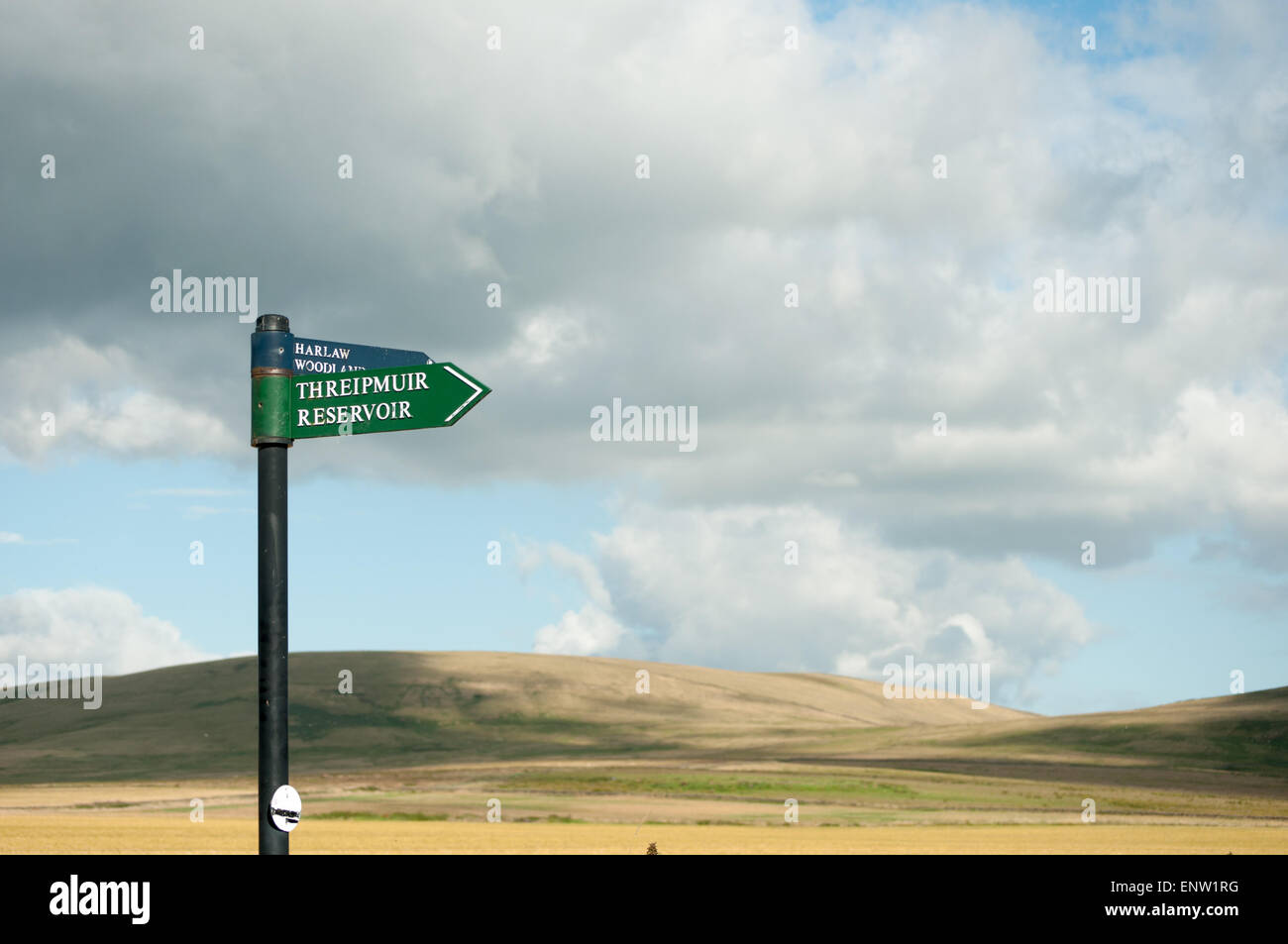 Sign for a walk to Treipmuir reservoir with hills and clouds in the ...