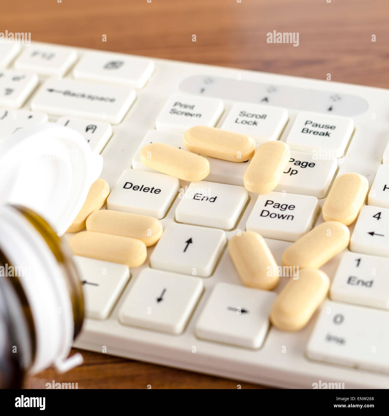 pills on keyboard computer on wooden background concept technology ...