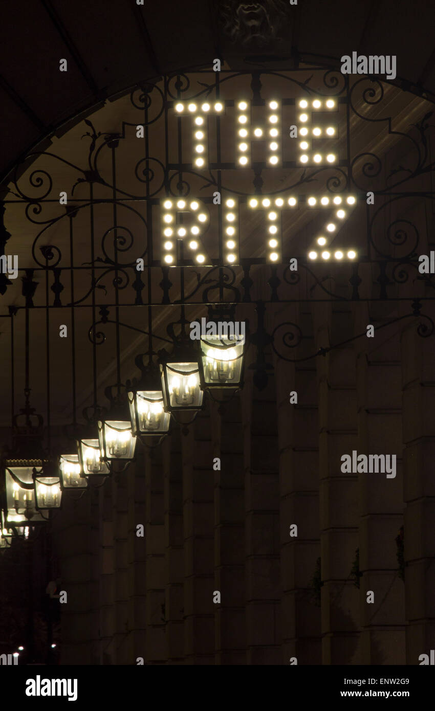 The Ritz Hotel sign lamps, lights and colonnade at night Piccadilly ...