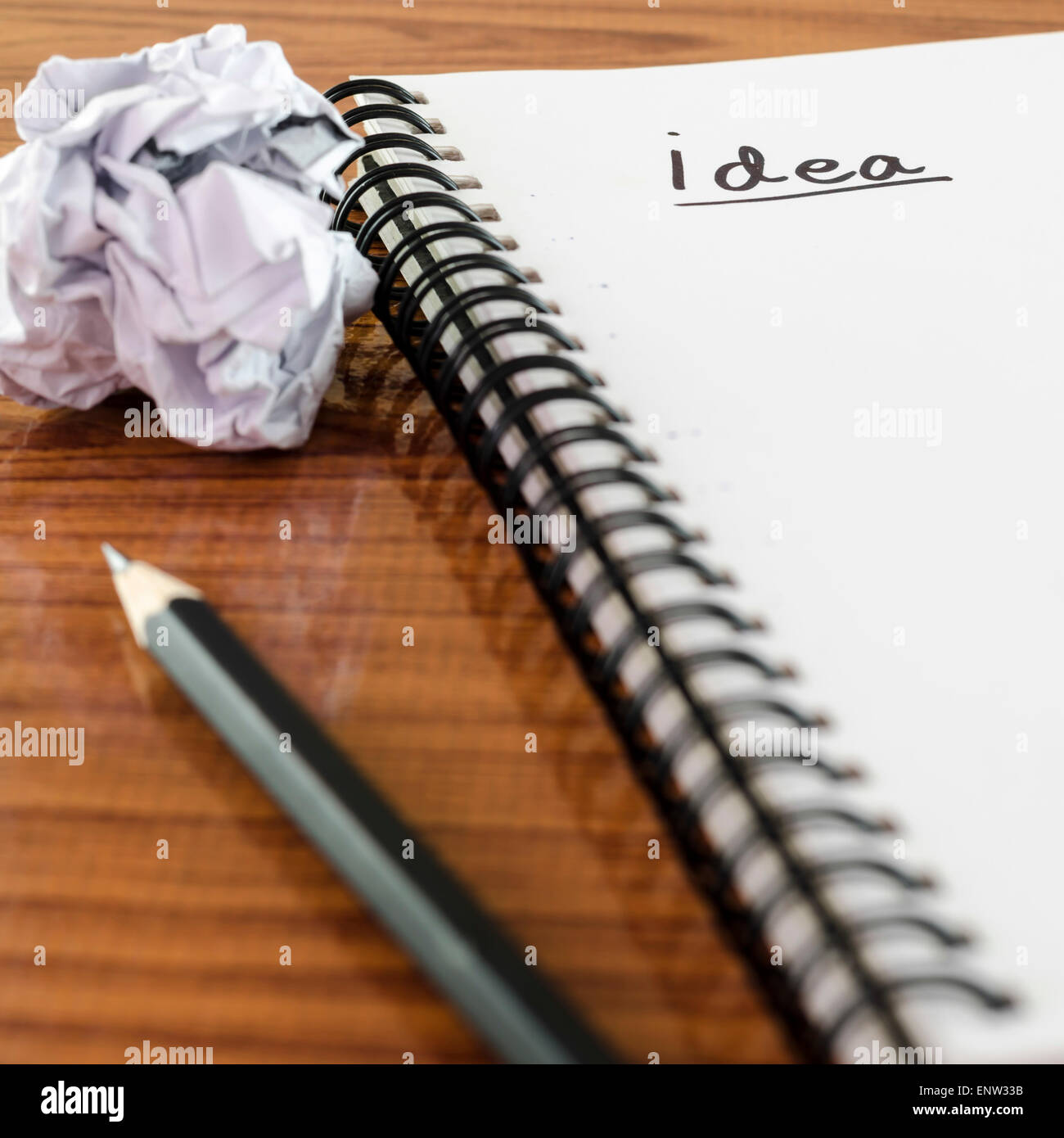 crumpled paper and pencil with notebook write idea word on wood ...