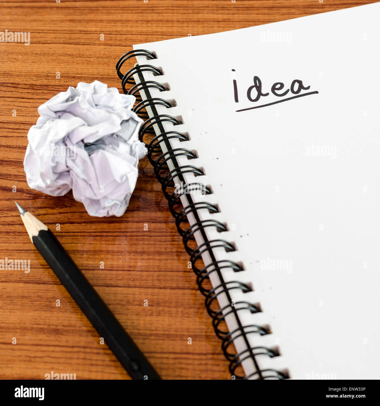 crumpled paper and pencil with notebook write idea word on wood ...