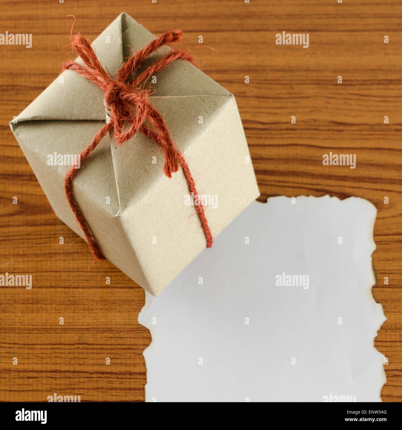 gift box with paper write your note on wood background Stock Photo - Alamy