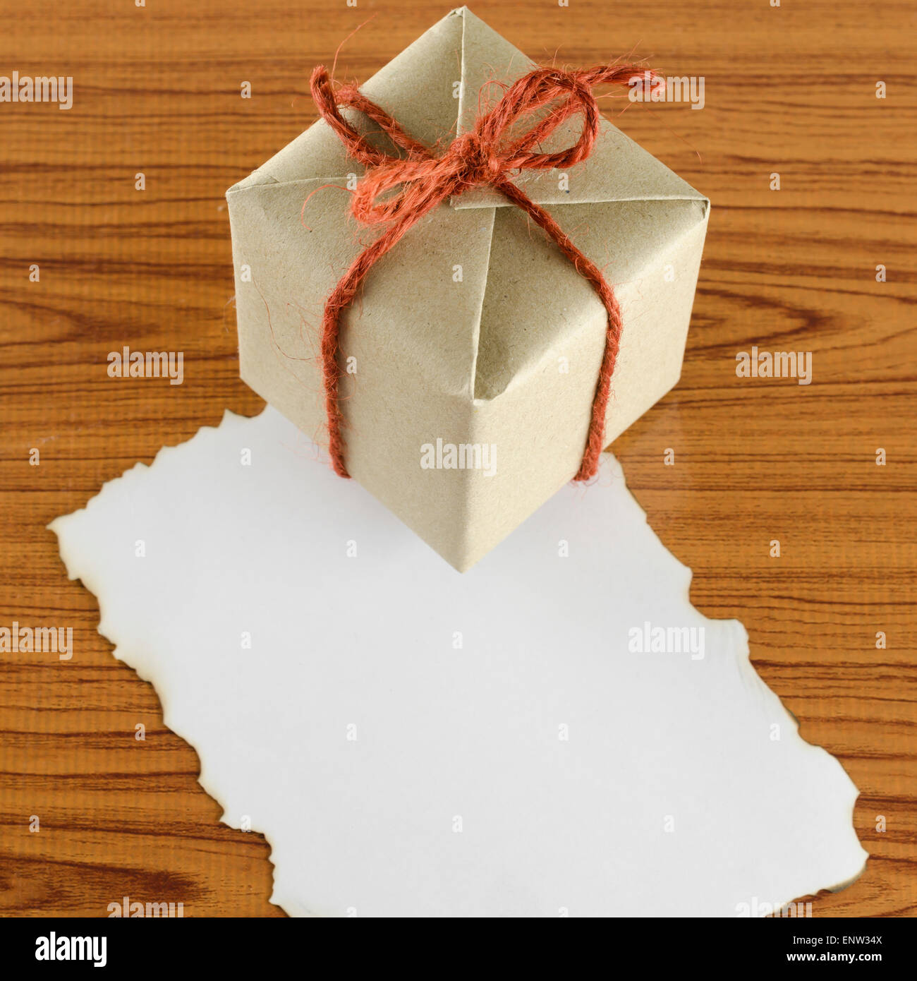 gift box with paper write your note on wood background Stock Photo - Alamy
