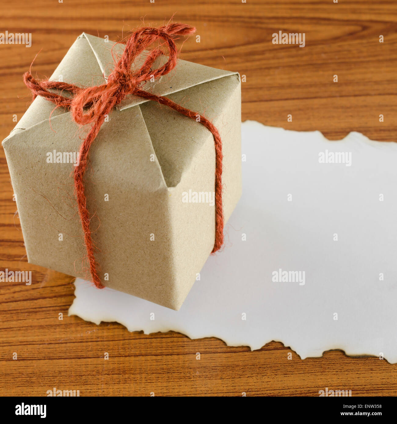 gift box with paper write your note on wood background Stock Photo - Alamy