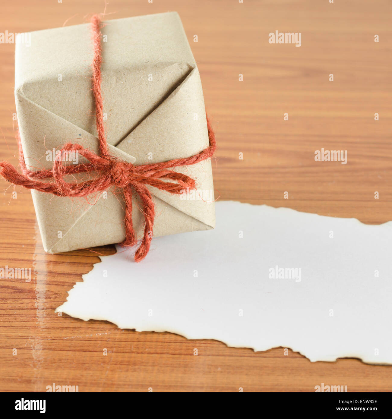 gift box with paper write your note on wood background Stock Photo - Alamy