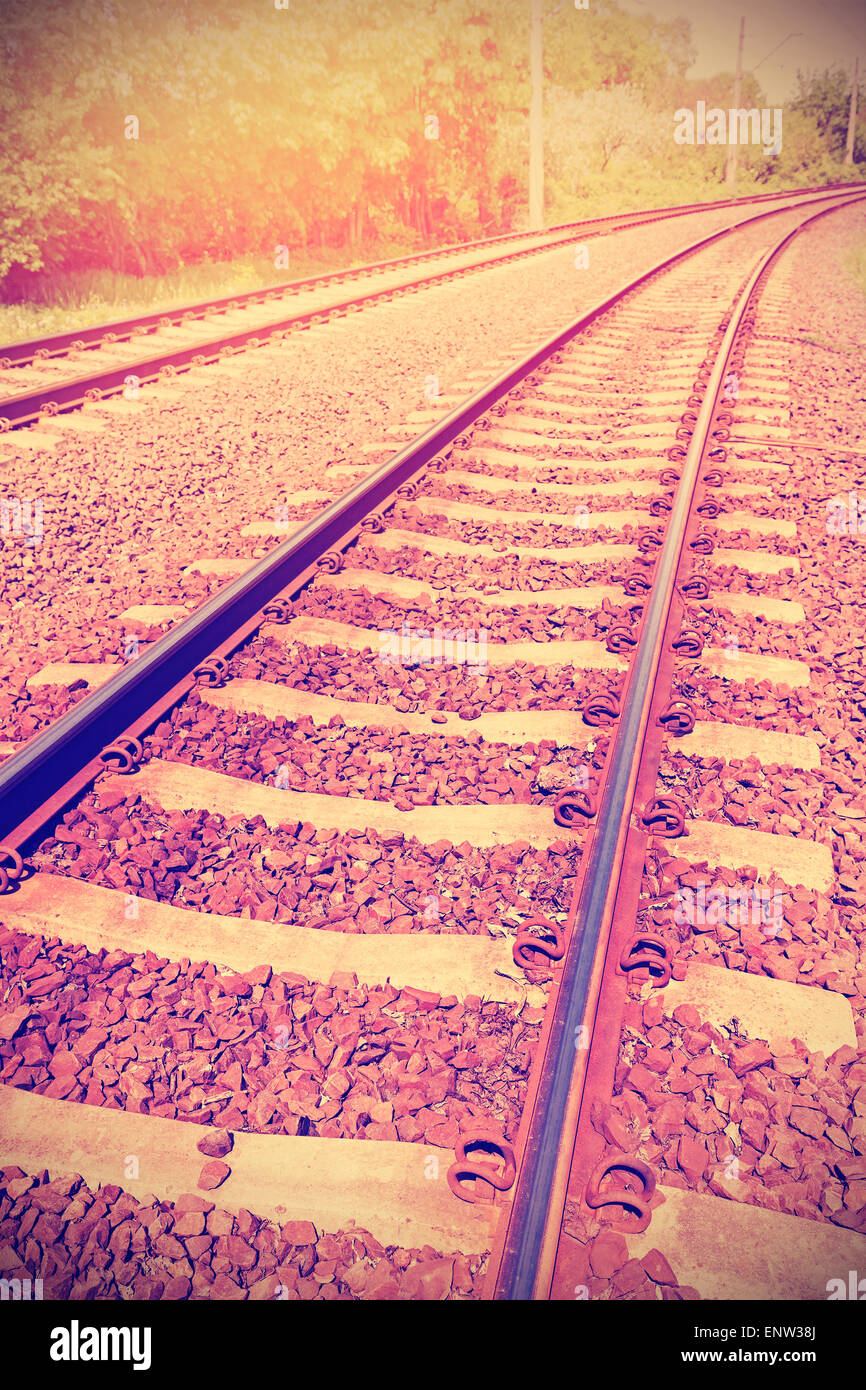 Vintage retro filtered picture of railroad tracks, old film effect ...