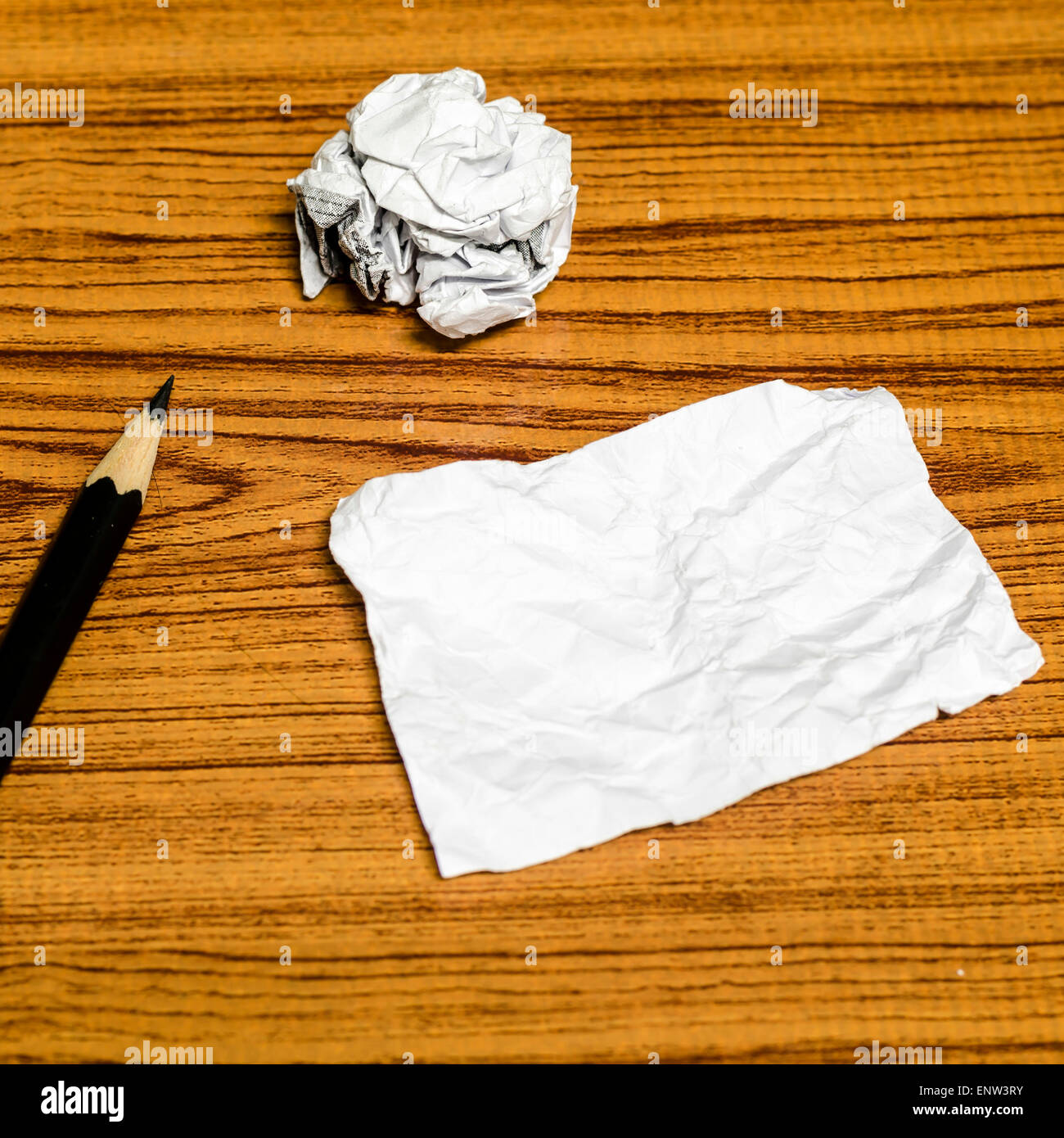 paper scrap and crumpled with pencil on wood background Stock Photo - Alamy