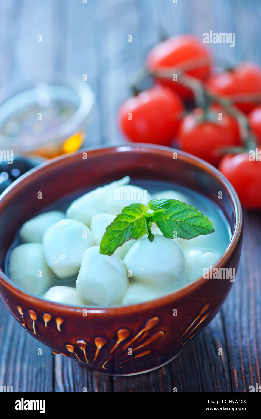 mozzarella in bowl and on a table Stock Photo - Alamy