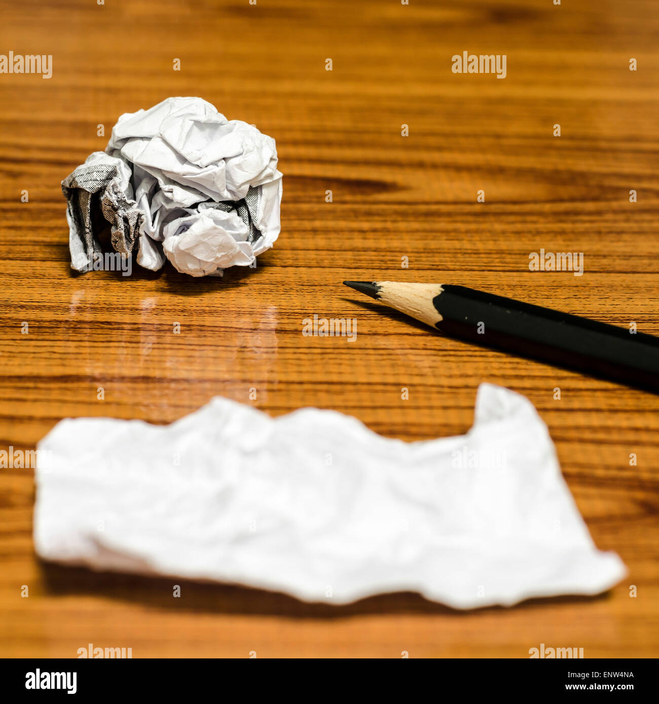 paper scrap and crumpled with pencil on wood background Stock Photo - Alamy