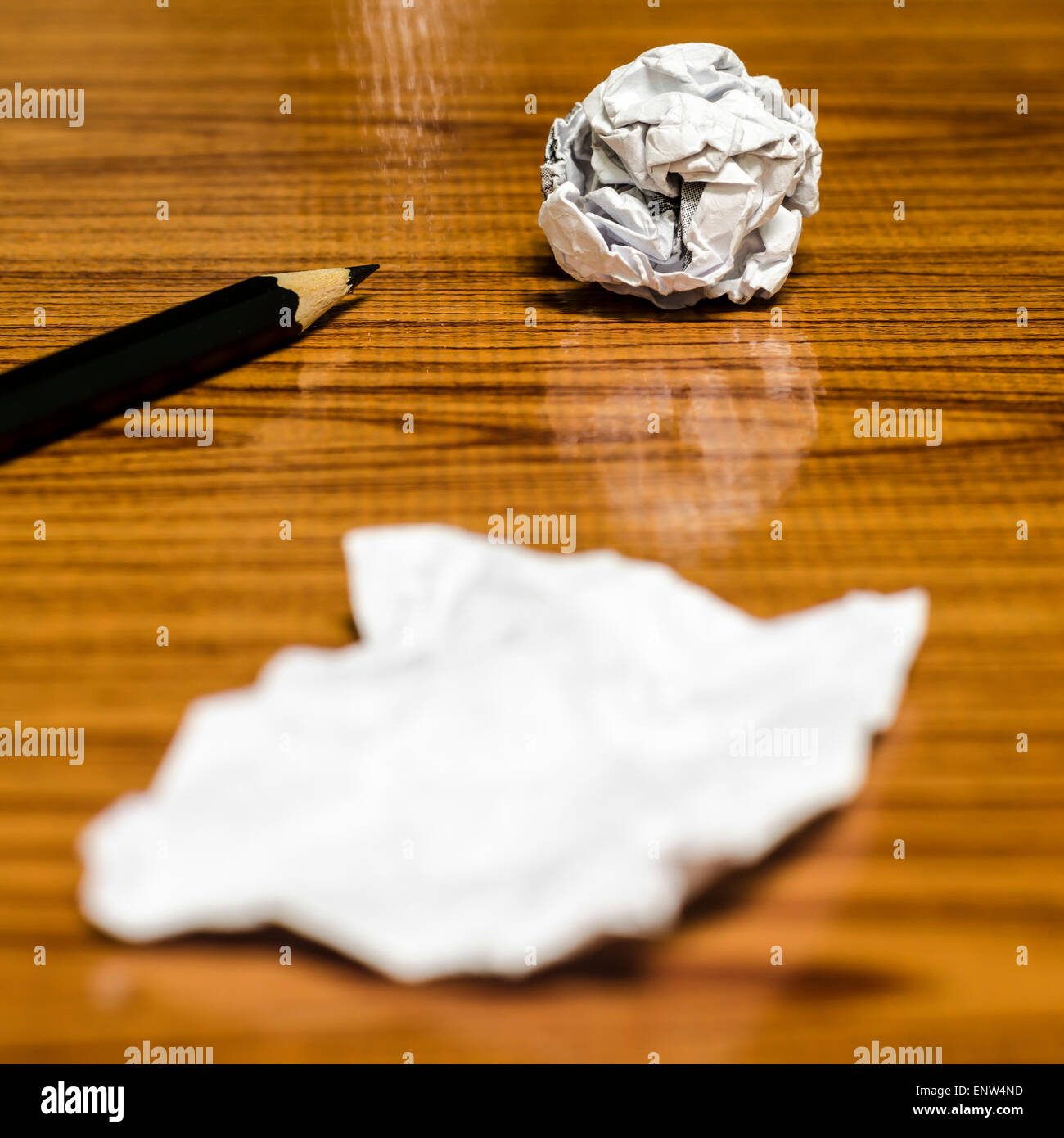 paper scrap and crumpled with pencil on wood background Stock Photo - Alamy