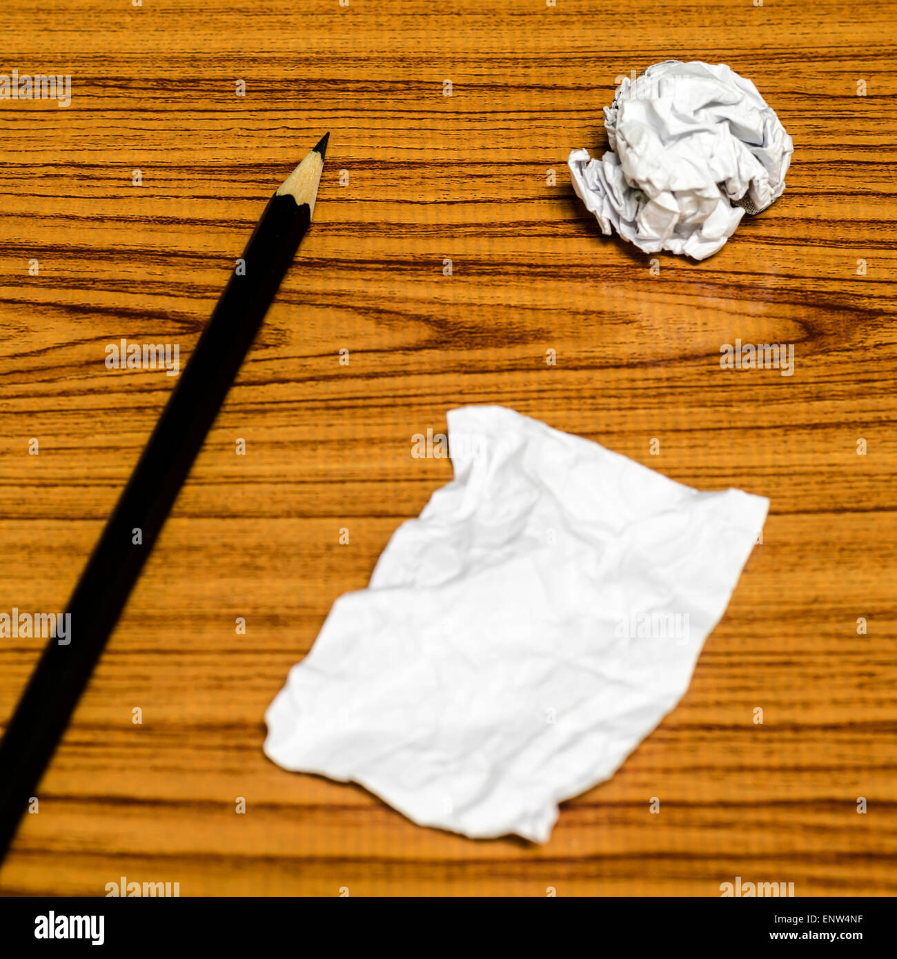 paper scrap and crumpled with pencil on wood background Stock Photo - Alamy