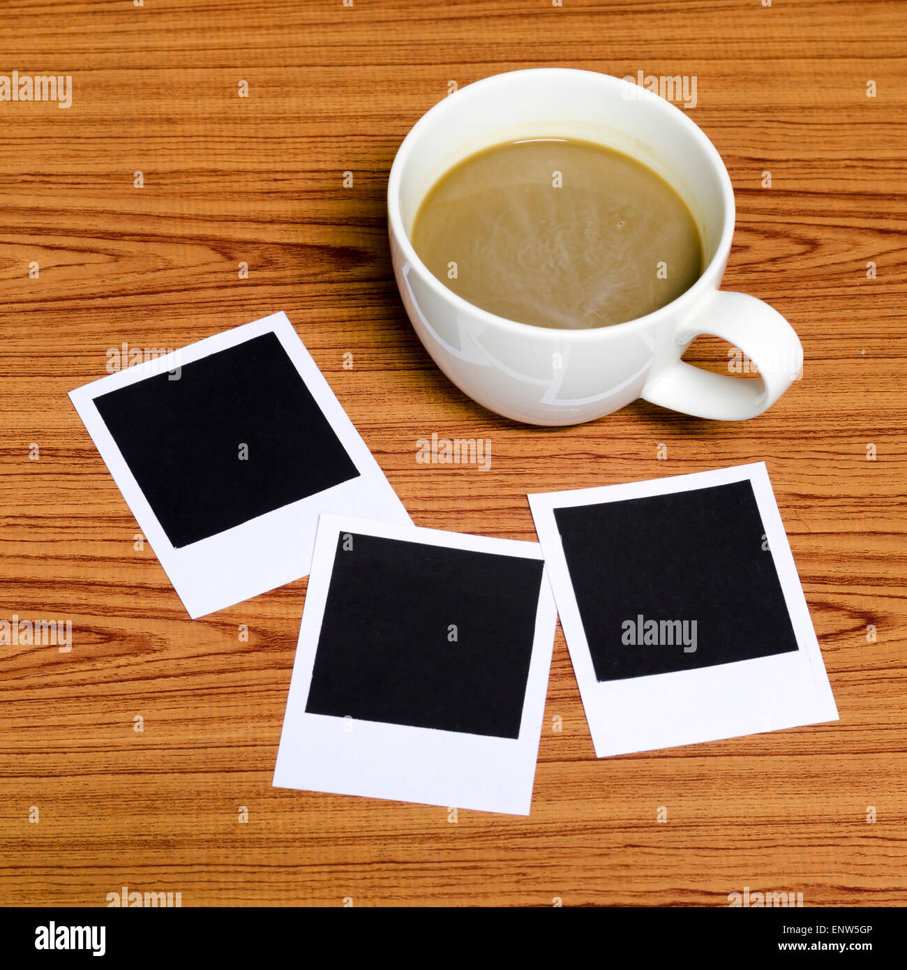 coffee cup with photo frame on wood background Stock Photo - Alamy