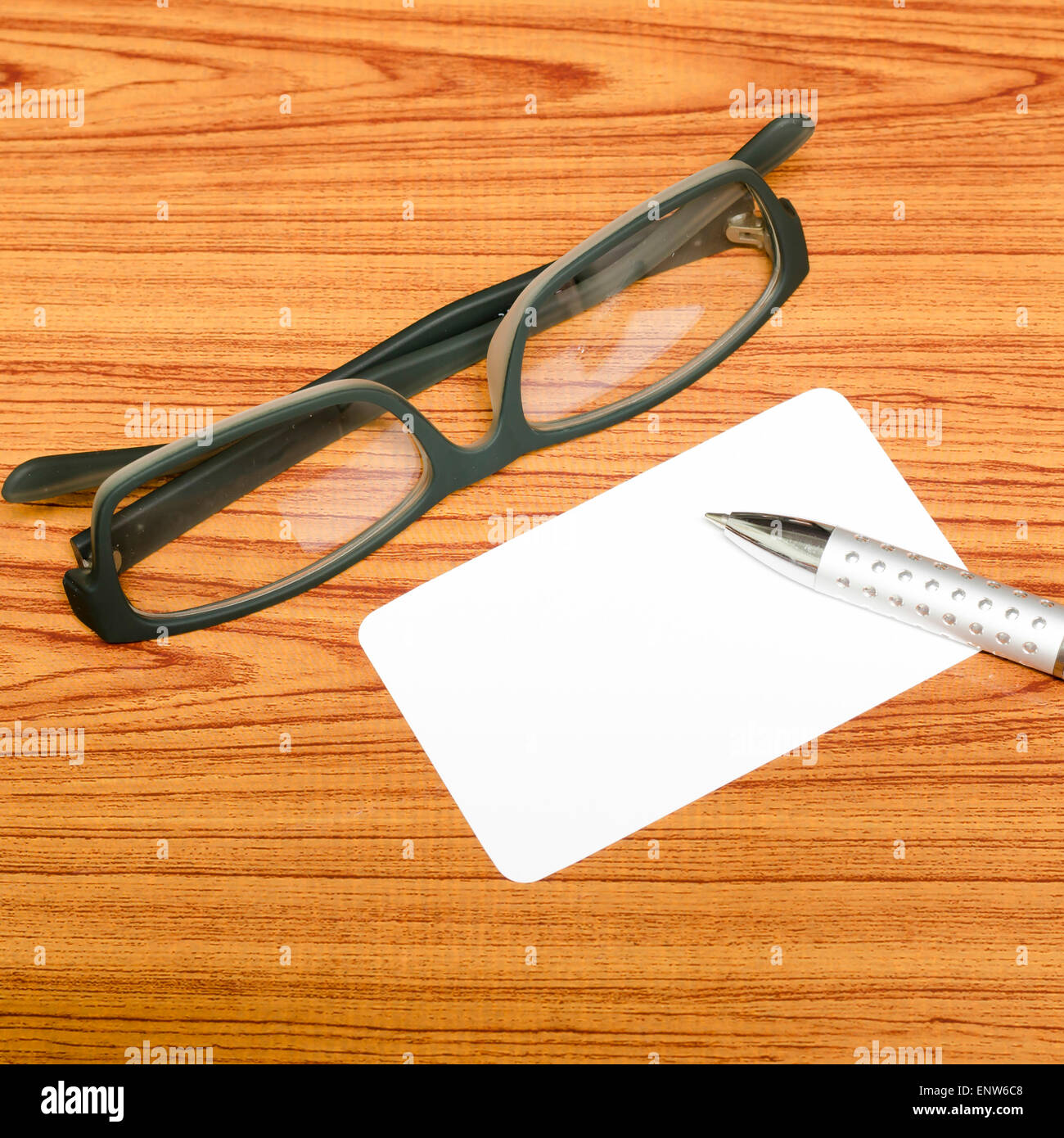 business card and pen with glasses on wood background Stock Photo - Alamy