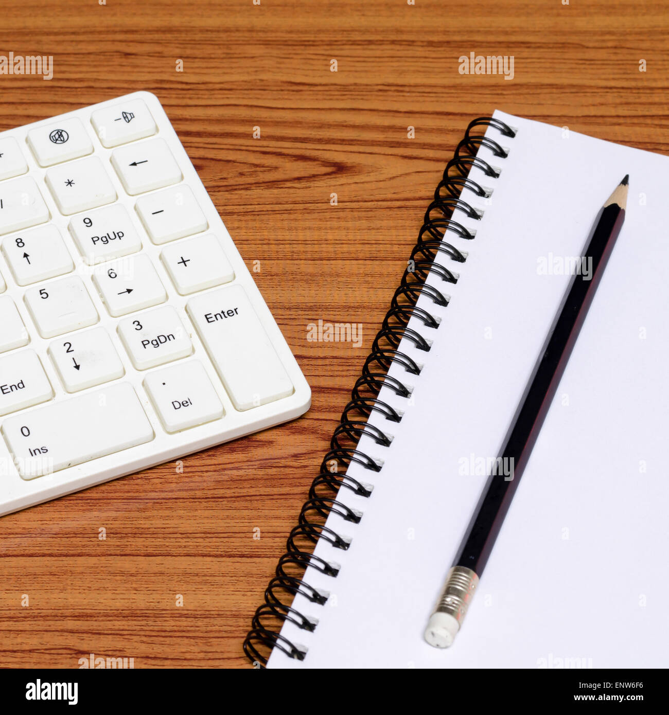 keyboard computer with notebook and pencil Stock Photo - Alamy