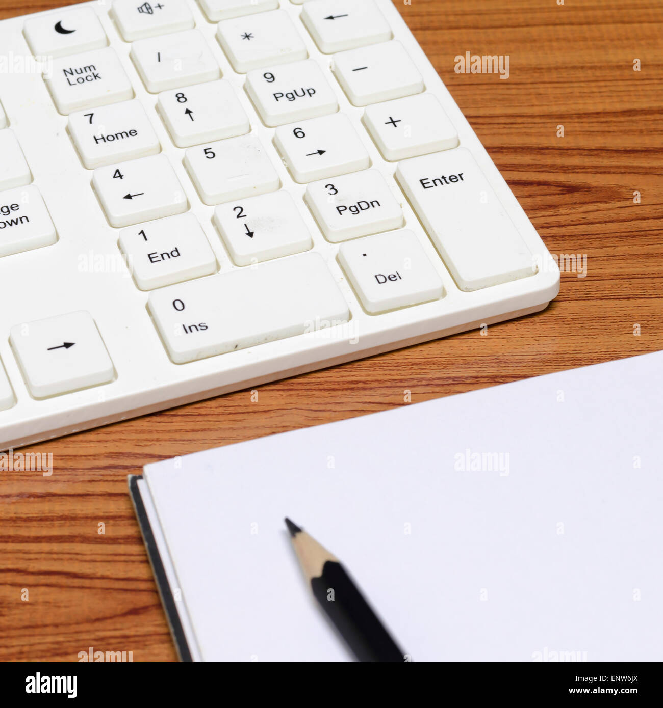 keyboard computer with notebook and pencil Stock Photo - Alamy