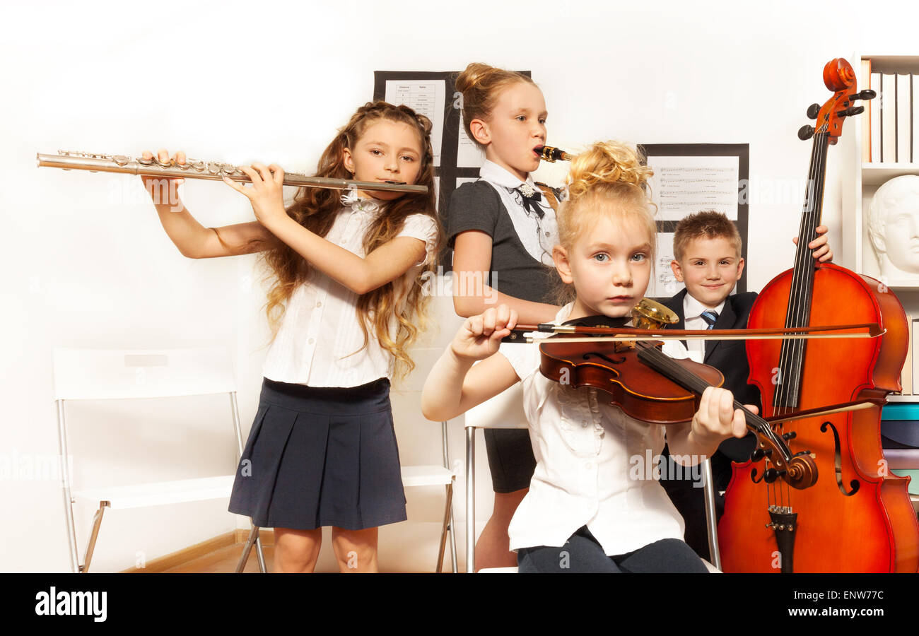 Girl and boy playing saxophone hi-res stock photography and images - Alamy