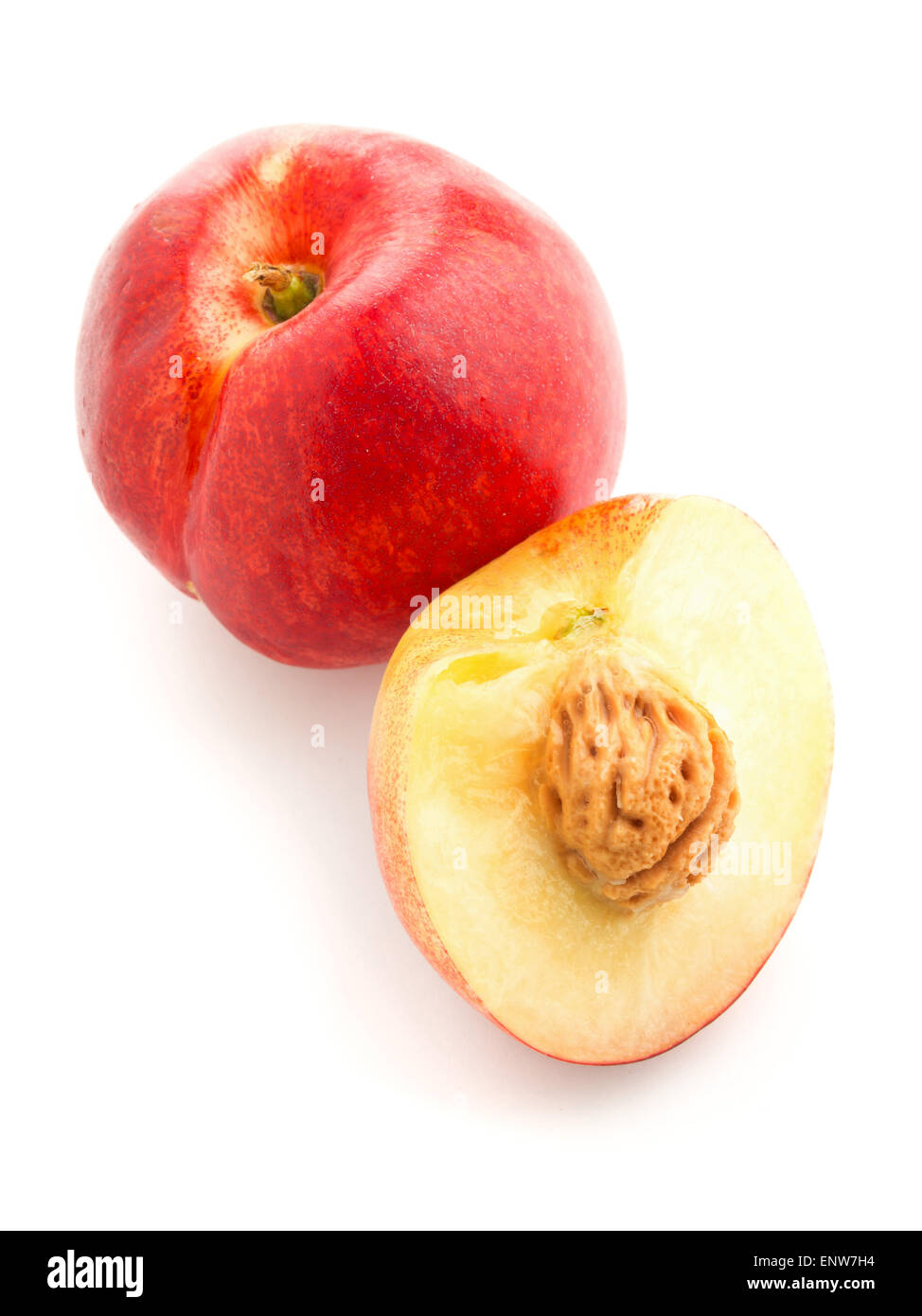 Whole and half cut white nectarine on white background Stock Photo - Alamy