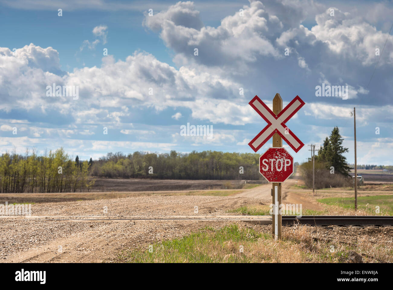 Shot up stop sign at a railway crossing Stock Photo - Alamy