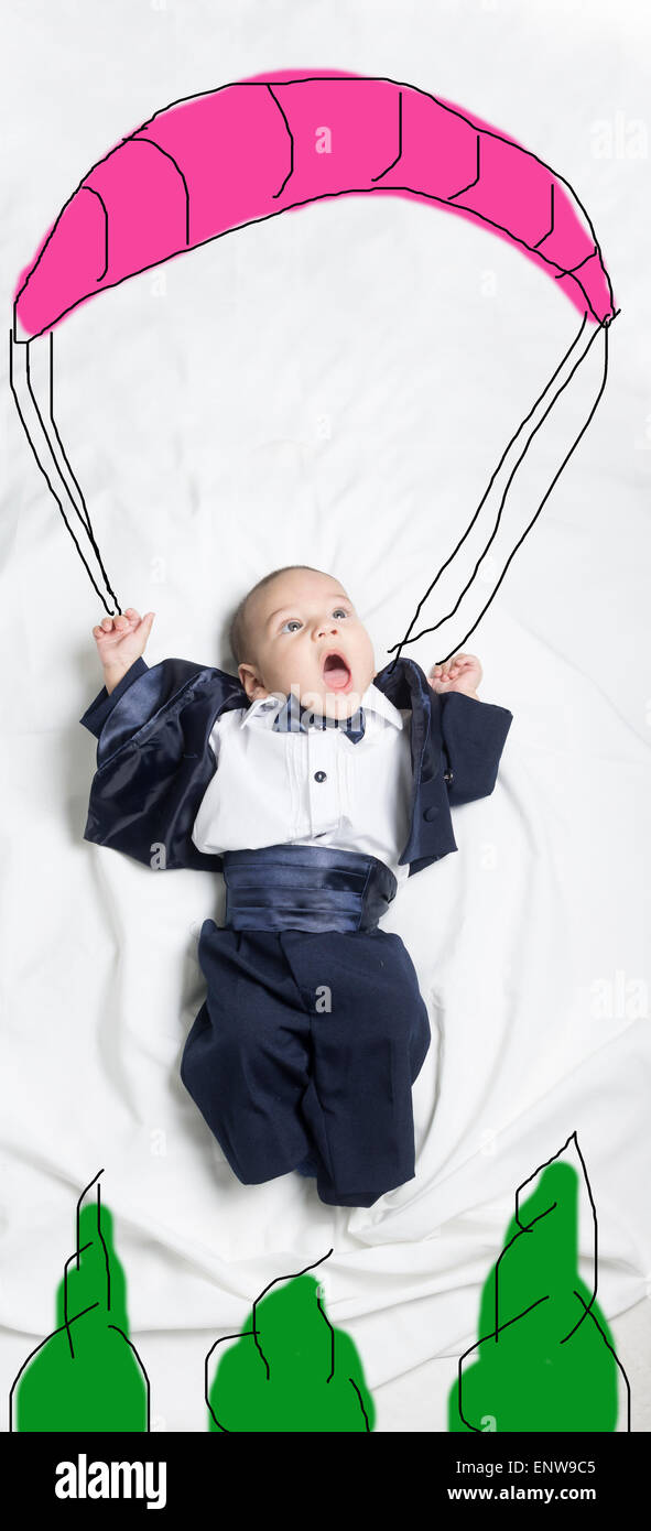 Cute baby boy decorated falling in a parachute Stock Photo - Alamy