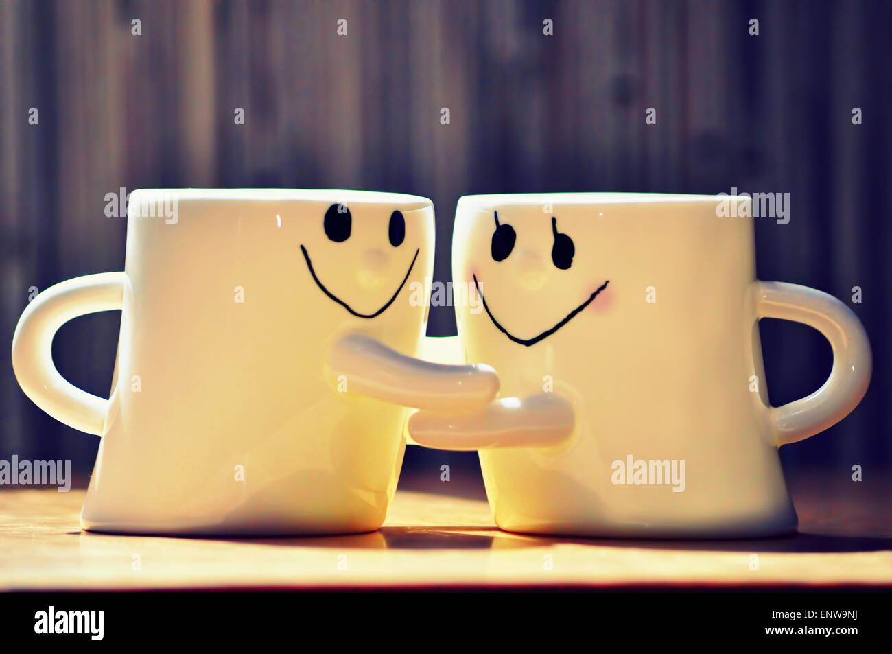 Cute Hugging Cups Stock Photo - Alamy