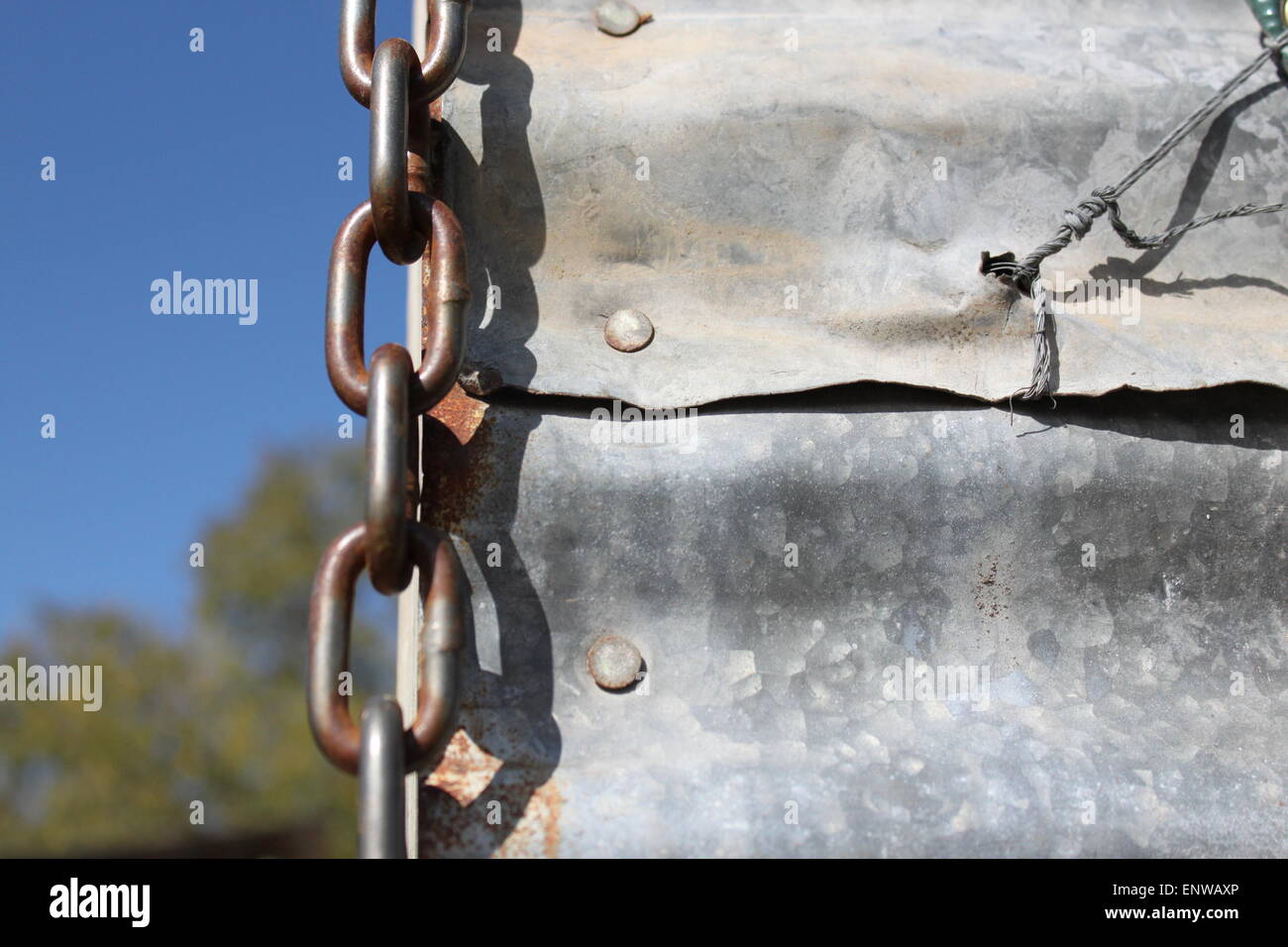 Chain on Metal Building Stock Photo - Alamy