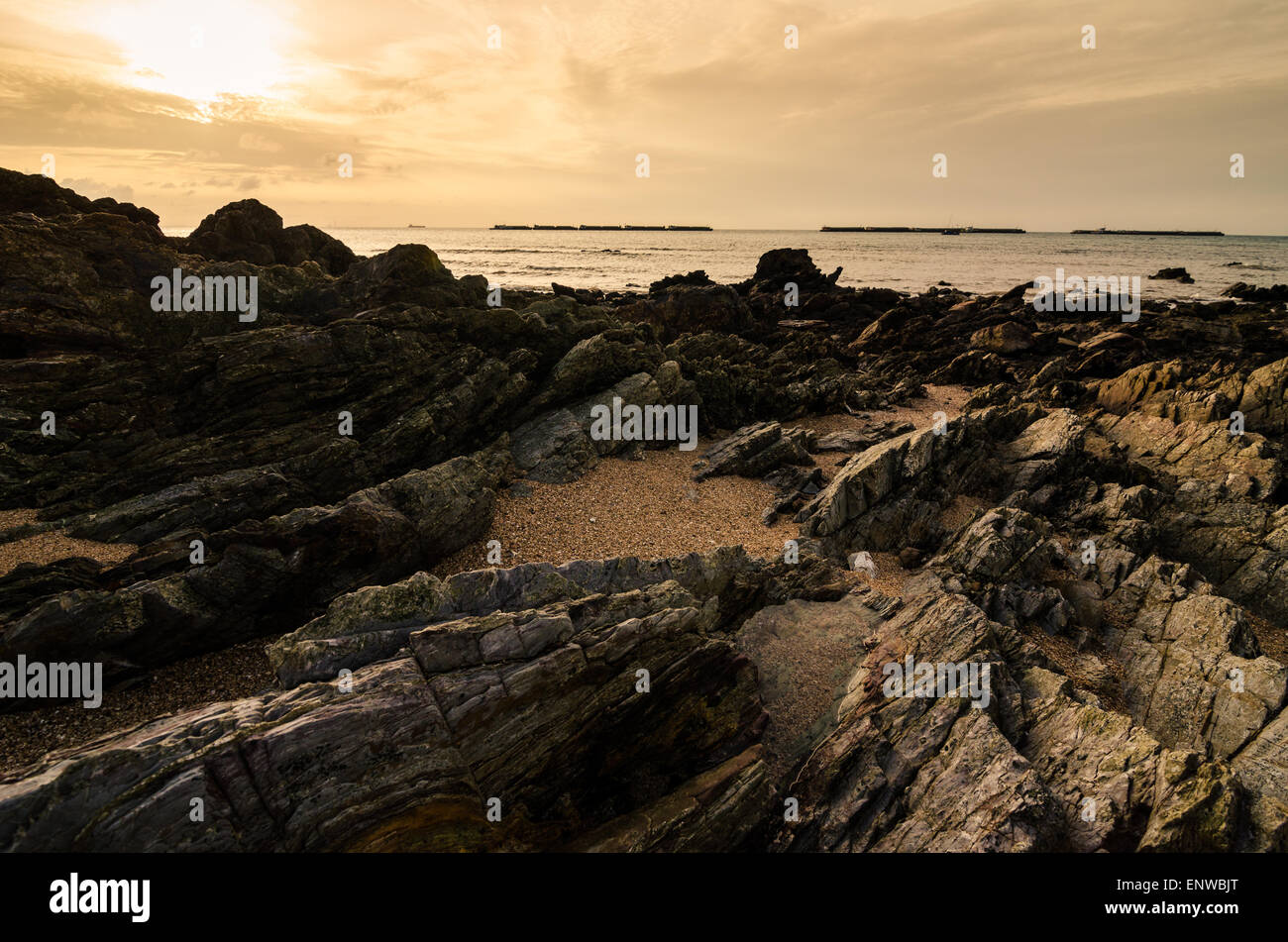 Rock and sea morning light in Thailand Stock Photo - Alamy
