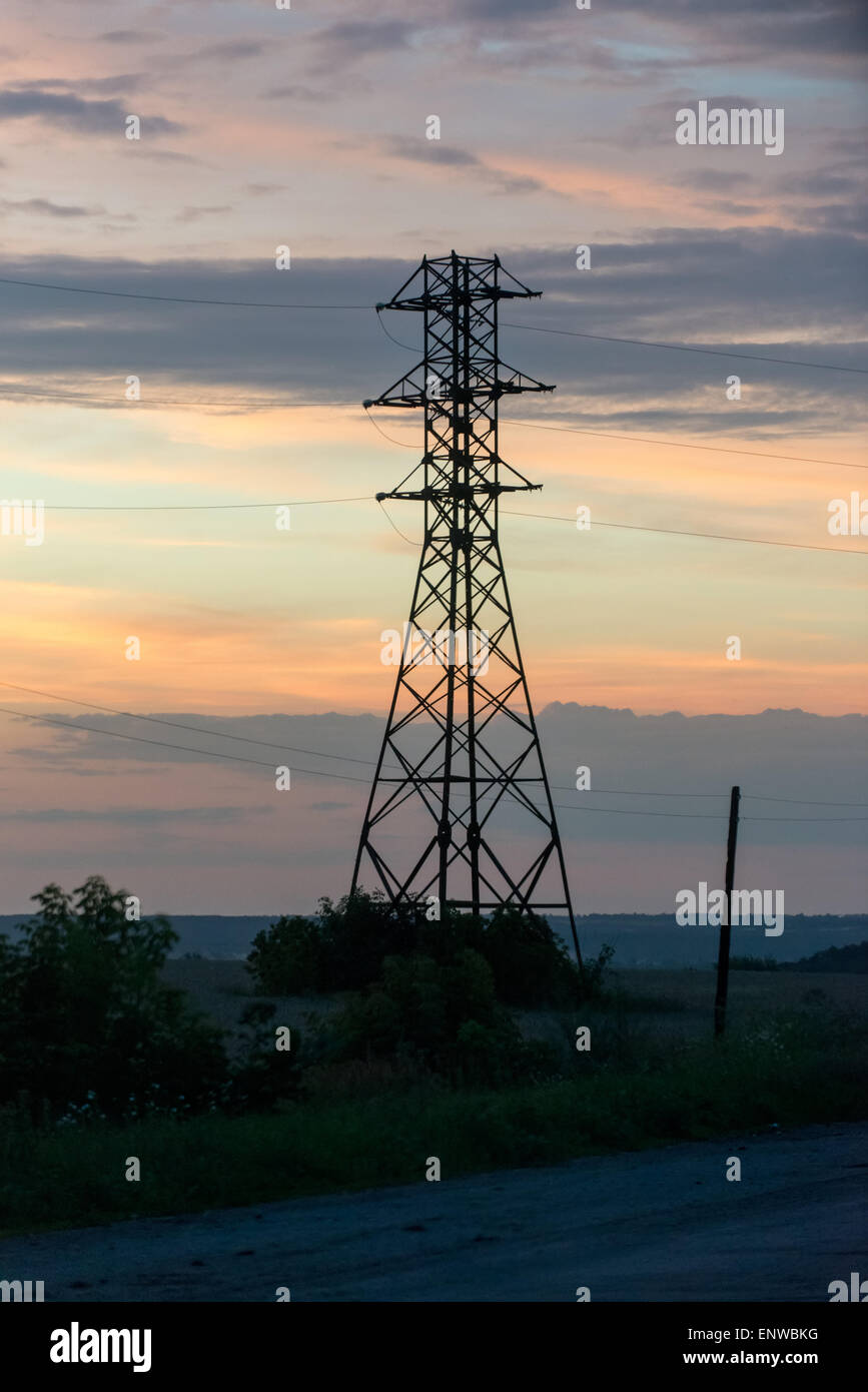 Electric pylon against the backdrop of the sunset evening sky on a ...