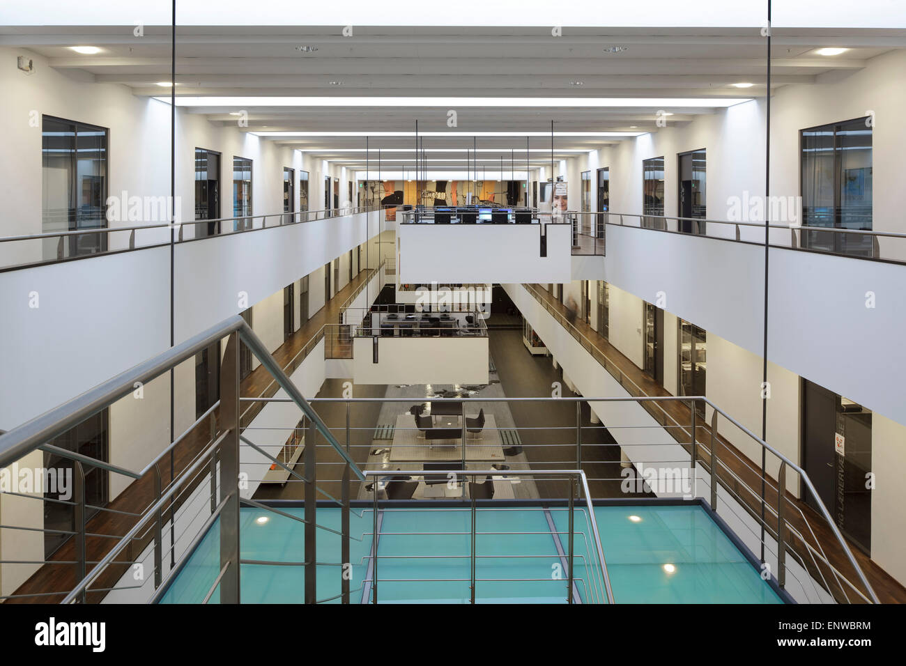 View of atrium with main staircase in foreground. IBC Kolding Campus ...