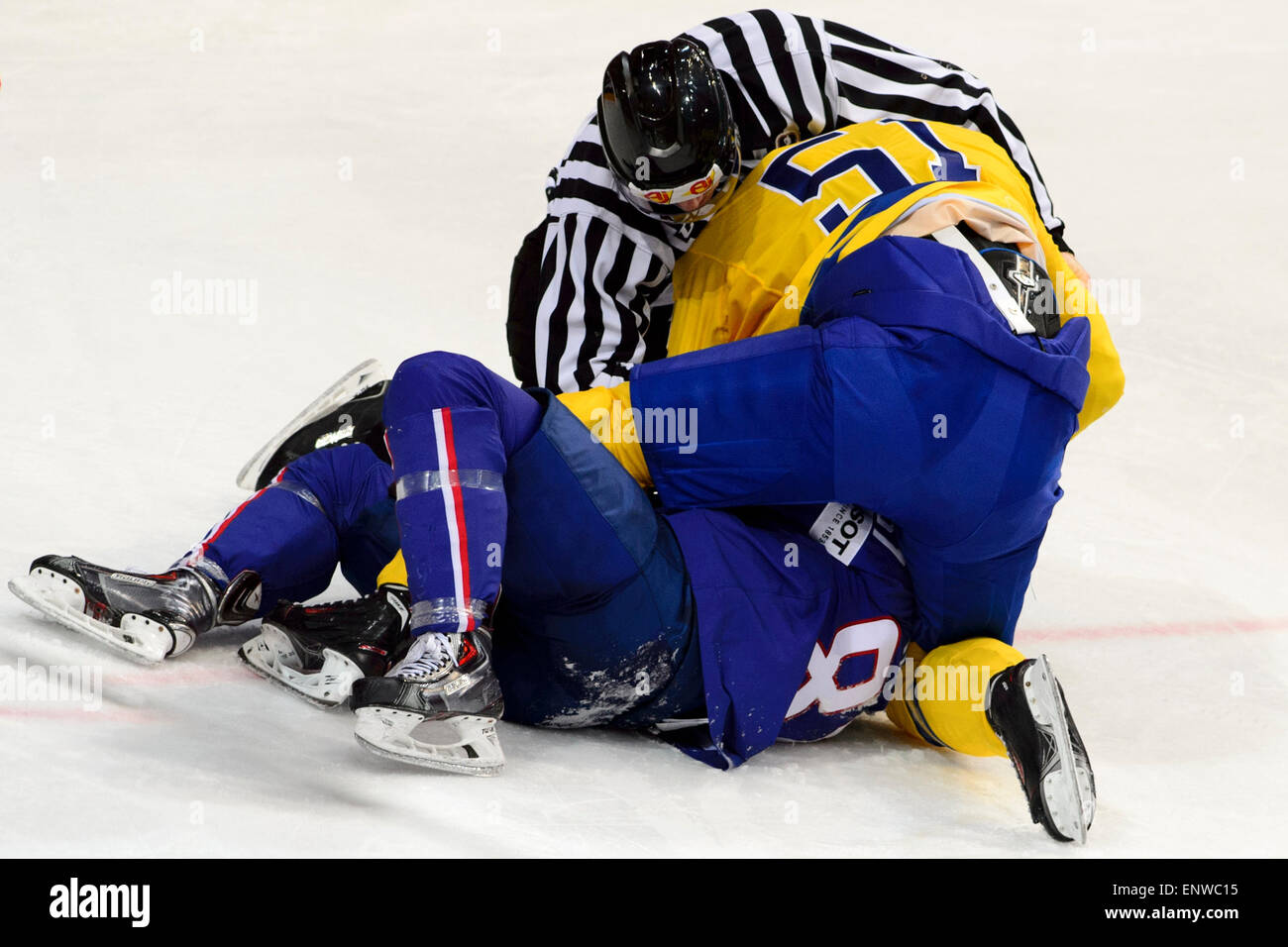 A referee tries to break up a fight between Anthony Rech of France ...