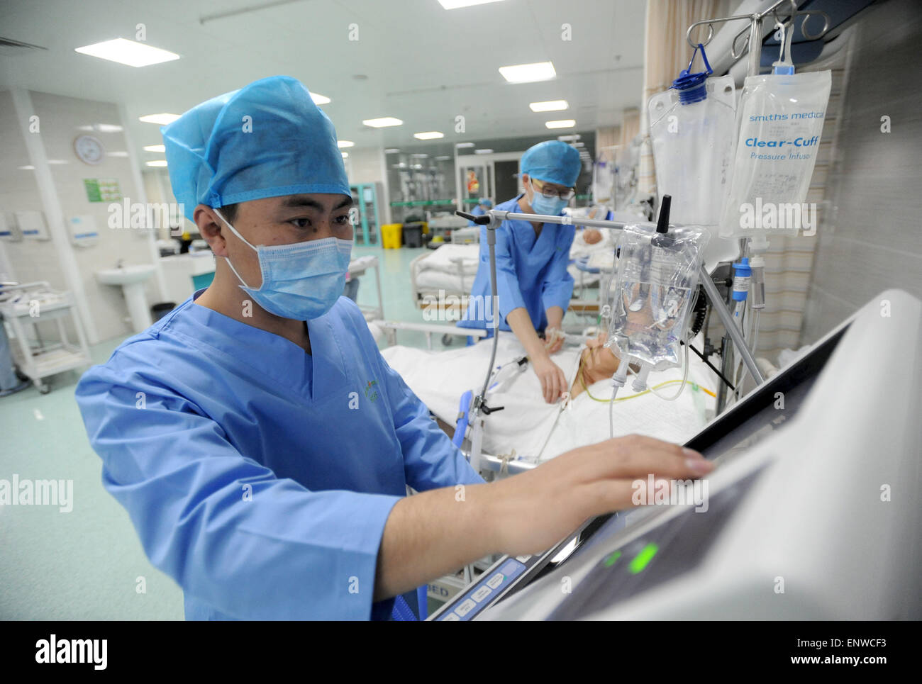 Shenyang, China's Liaoning Province. 11th May, 2015. Nurse Li Hongfei works at the ICU in No.4 ...