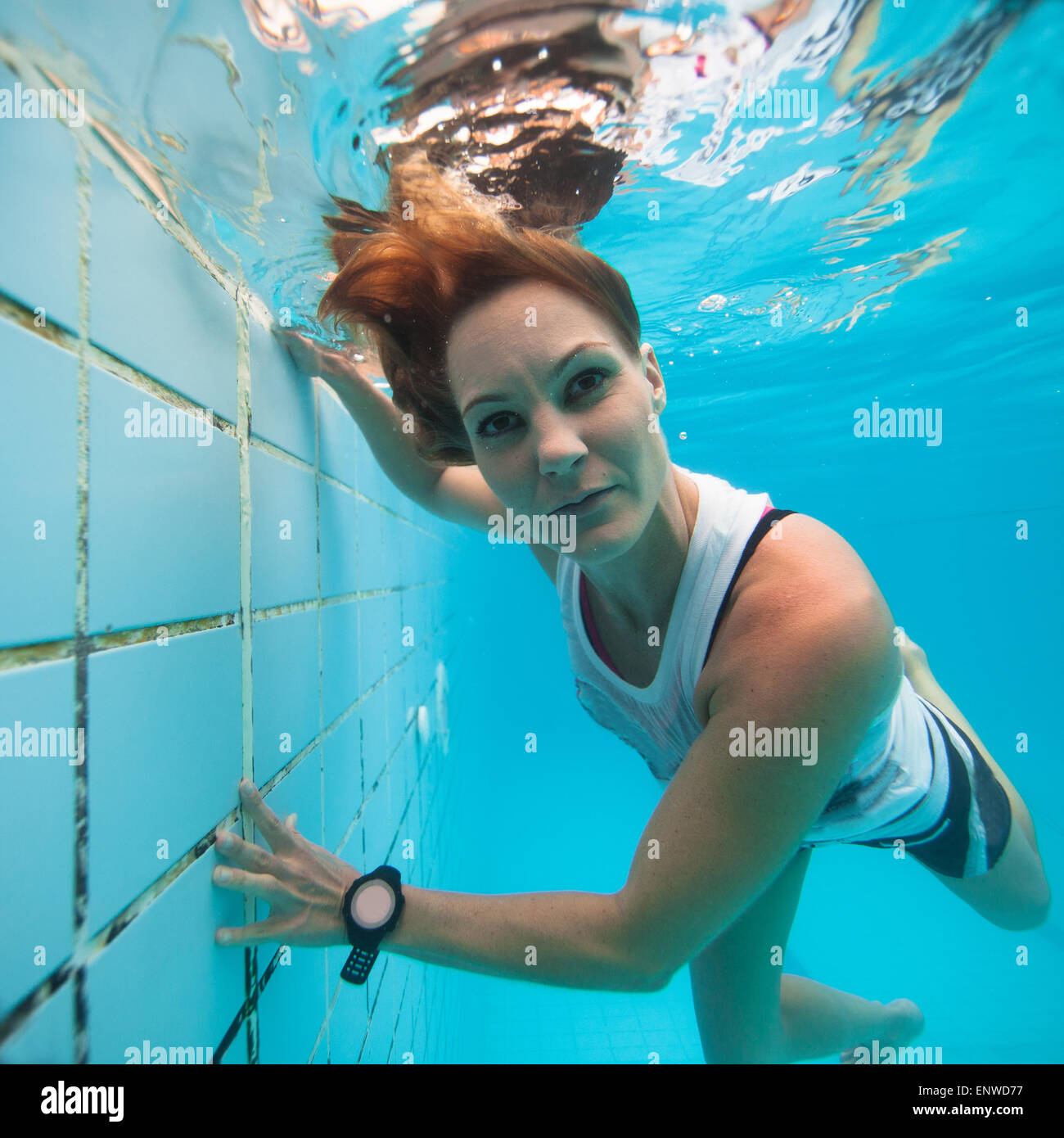 Woman freediving underwater in a pool Stock Photo - Alamy