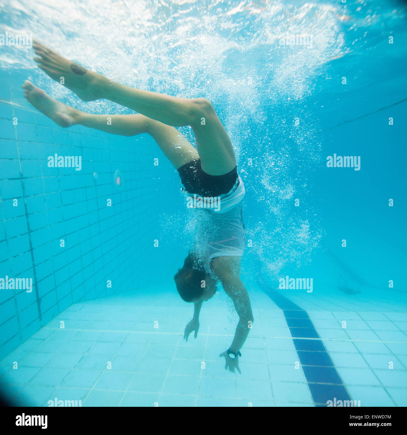 Woman freediving underwater in a pool Stock Photo - Alamy