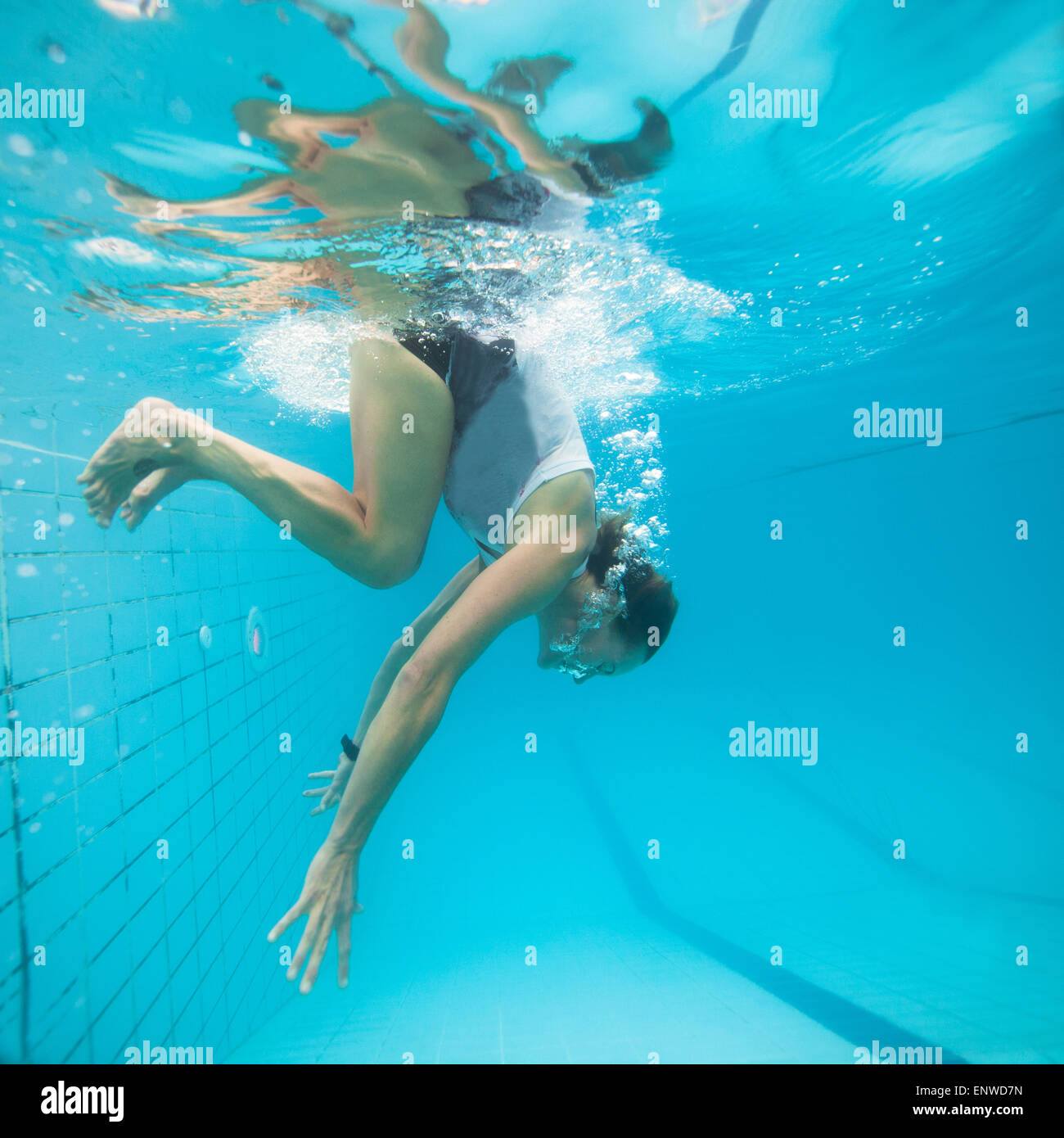 Woman freediving underwater in a pool Stock Photo - Alamy