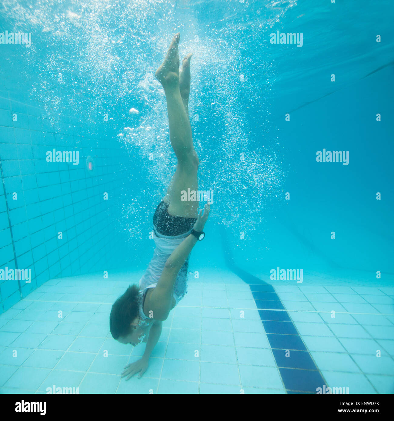 Woman freediving underwater in a pool Stock Photo - Alamy