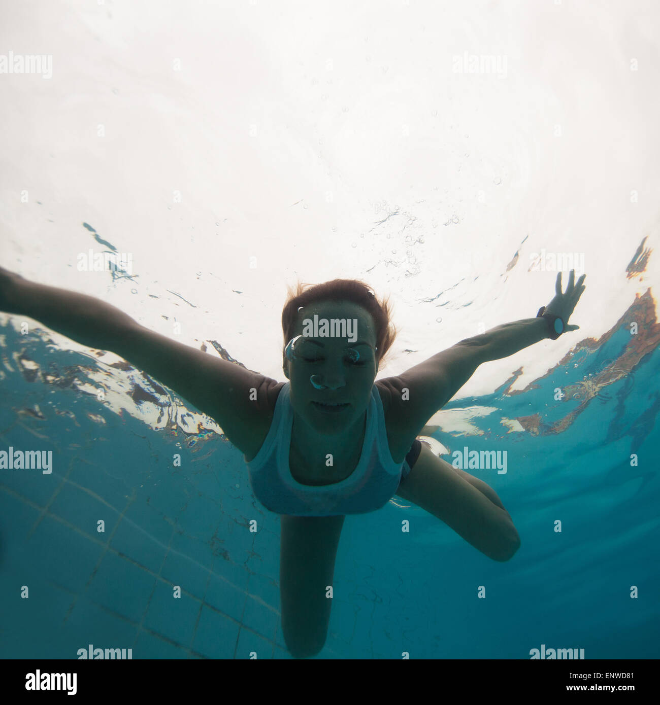 Woman freediving underwater in a pool Stock Photo - Alamy