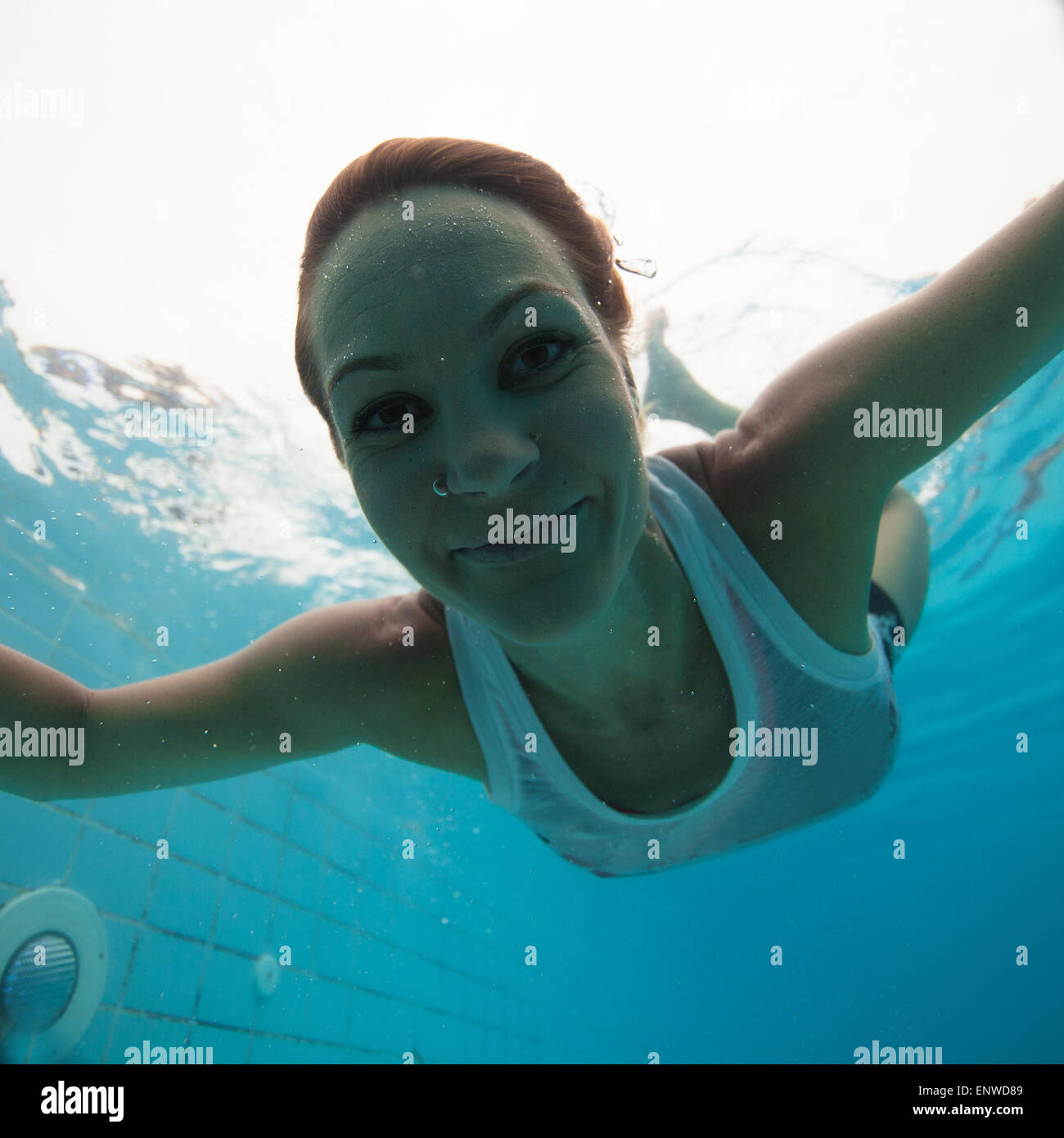 Woman freediving underwater in a pool Stock Photo - Alamy