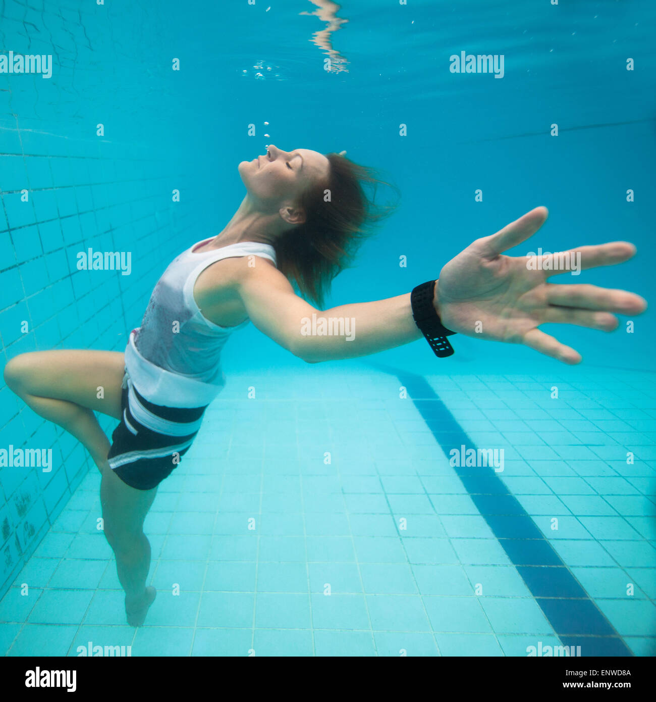 Woman freediving underwater in a pool Stock Photo - Alamy