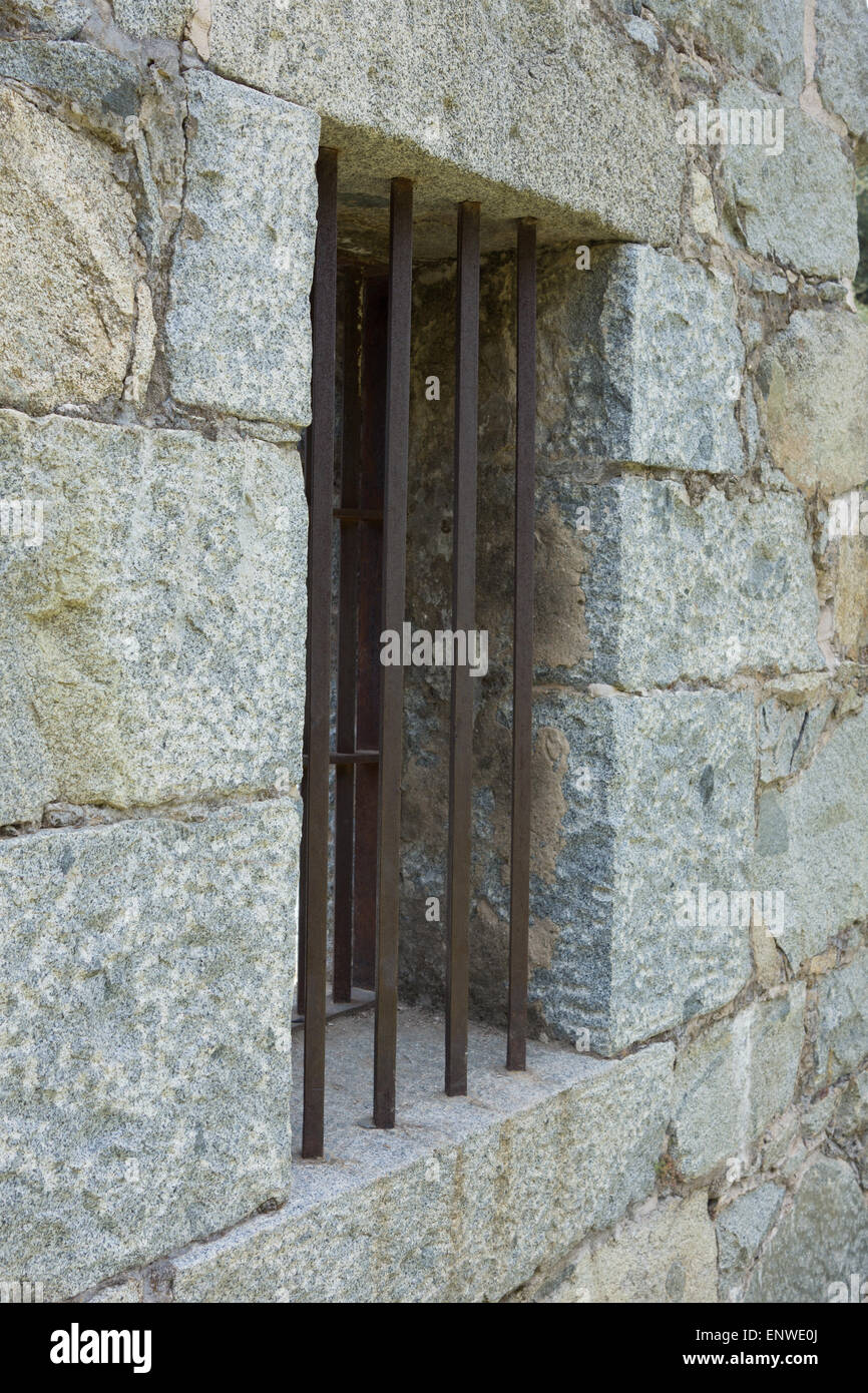 Brick exterior window iron grate wall Stock Photo - Alamy